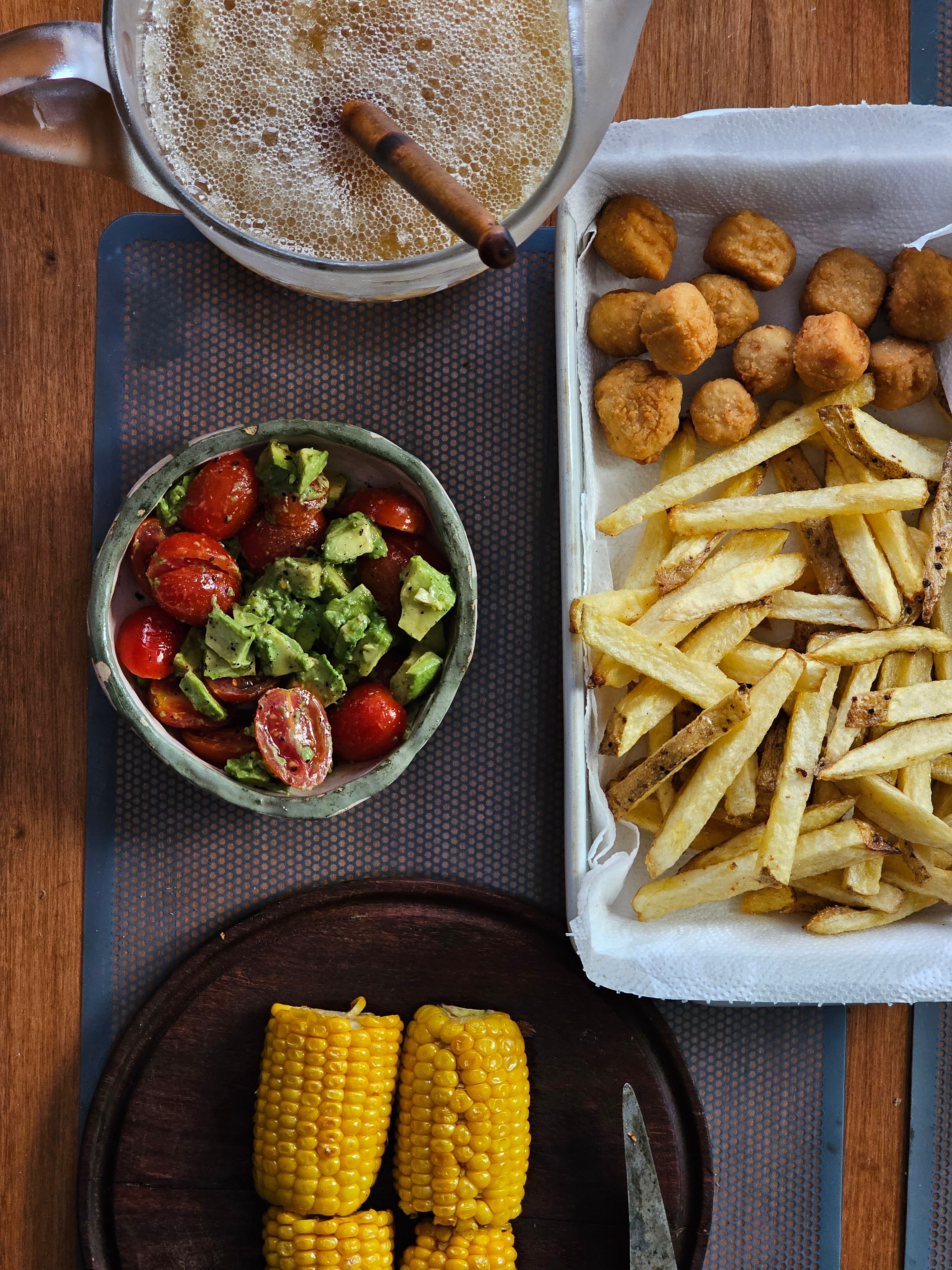 Delicious Spread of Fried Snacks and Veggies · Free Stock Photo