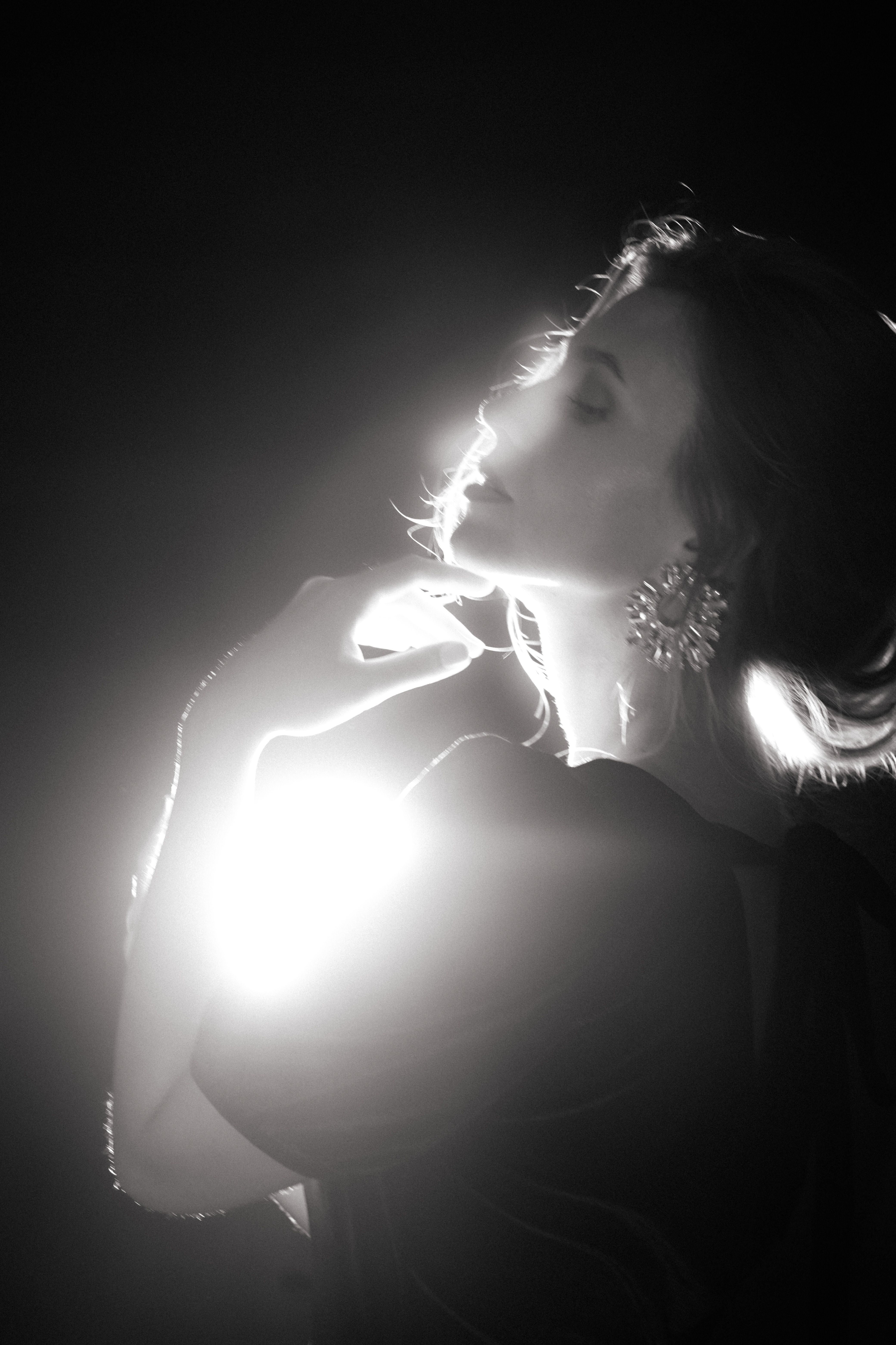Elegant Black and White Portrait with Dramatic Lighting · Free Stock Photo