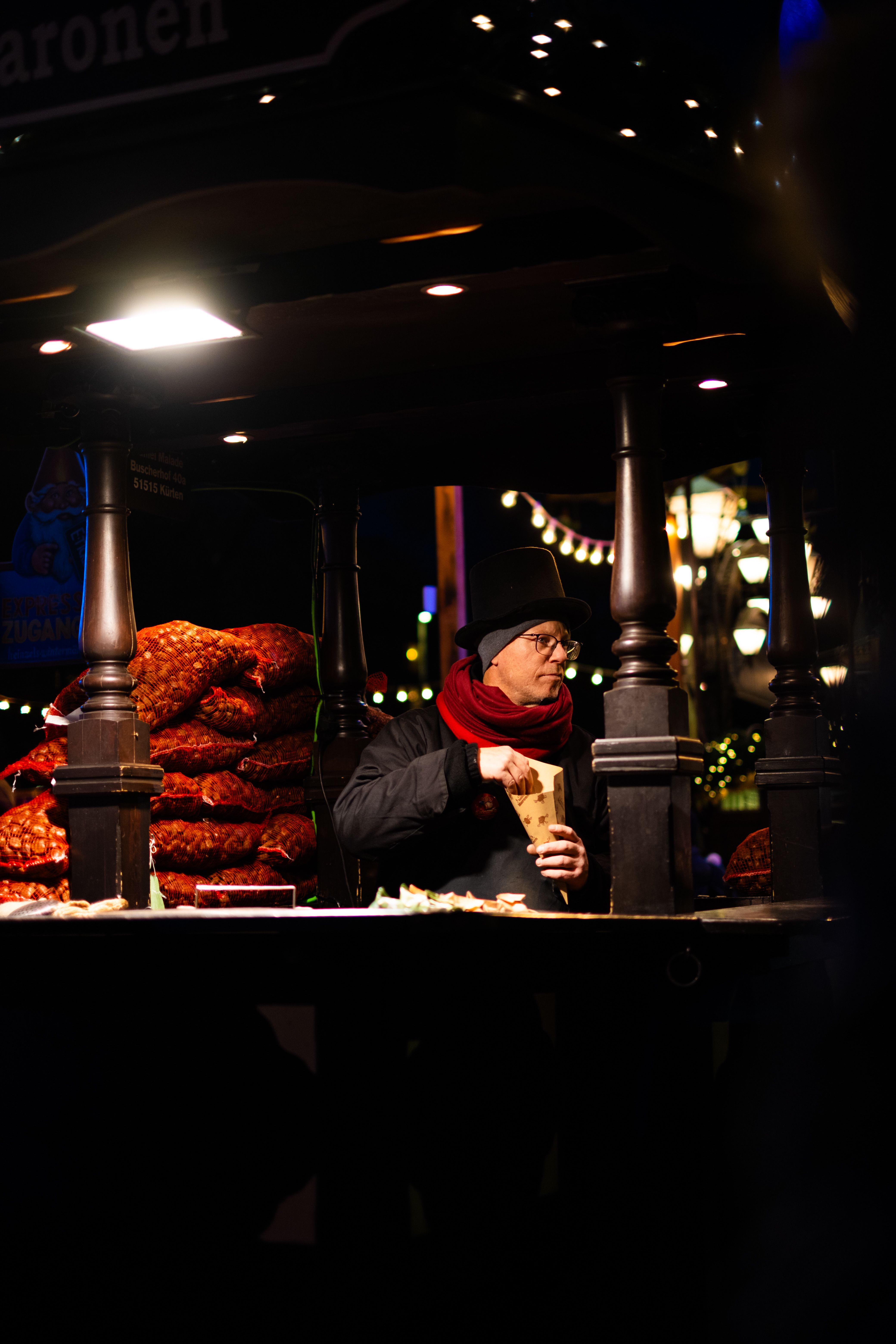 Night Market Vendor at Festive Stall · Free Stock Photo