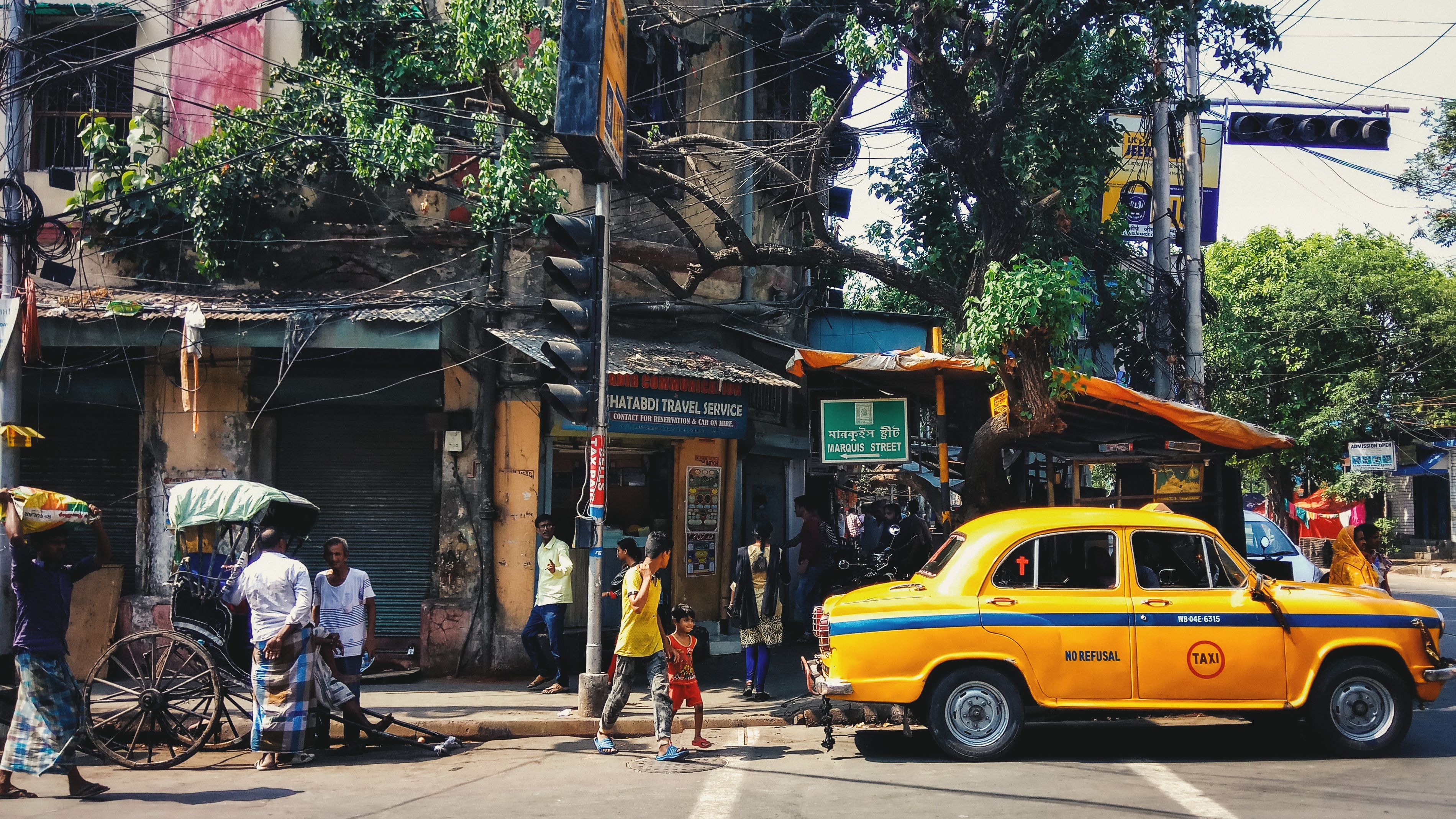Street Scene in Kolkata with Classic Taxi · Free Stock Photo