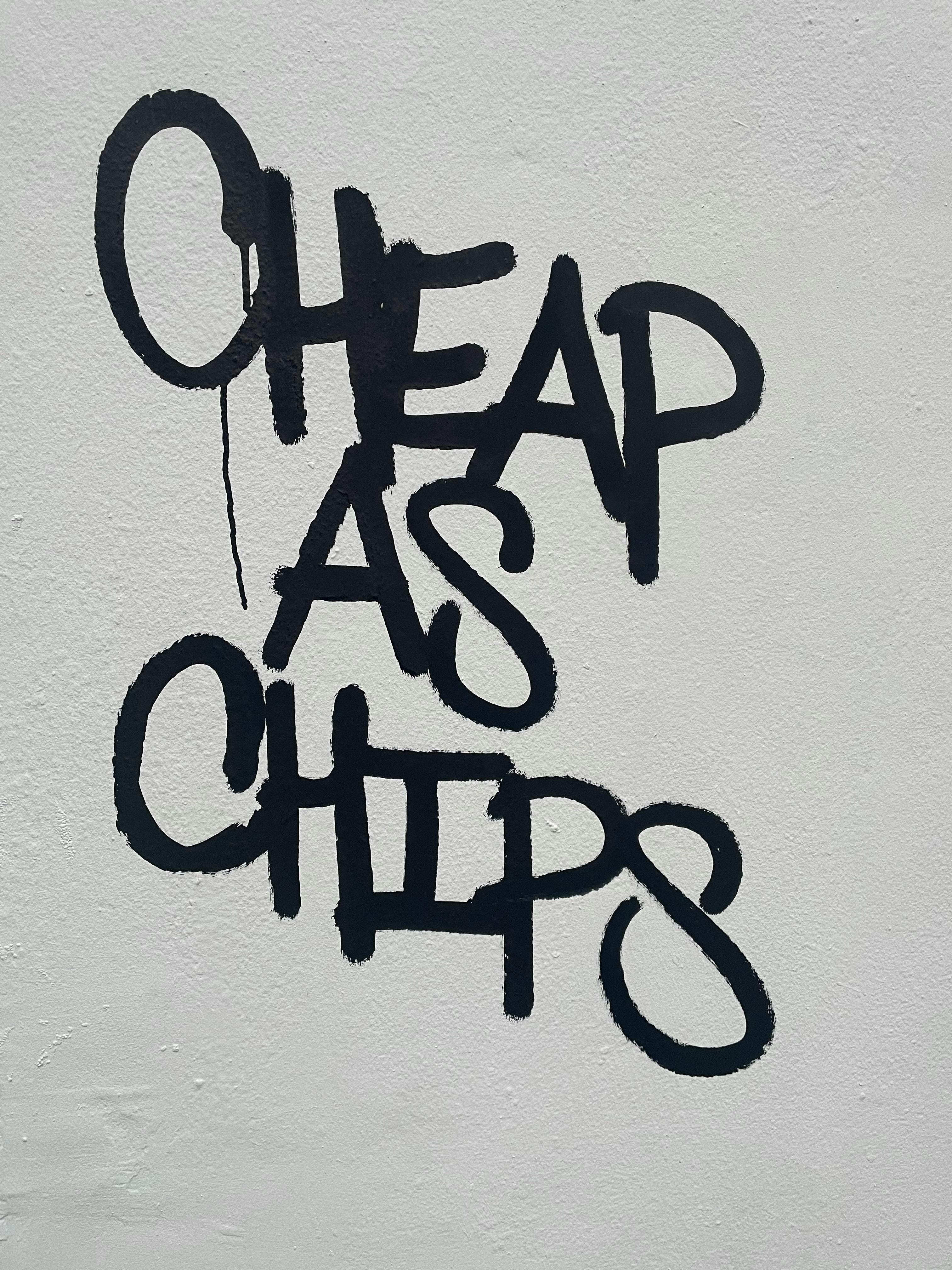 Graffiti Art with Phrase 'Cheap as Chips' · Free Stock Photo