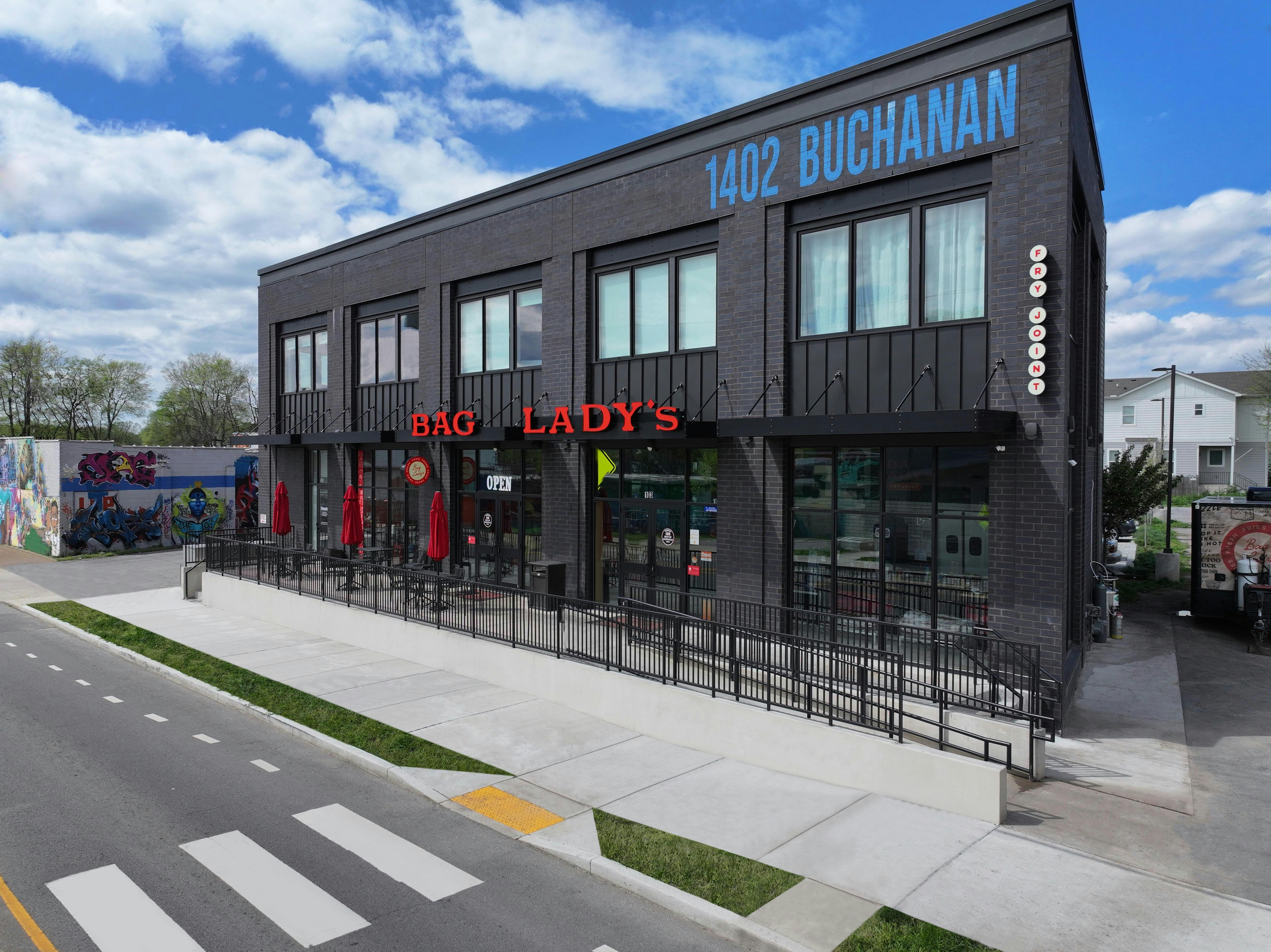 Contemporary Urban Building with Restaurant Exterior · Free Stock Photo