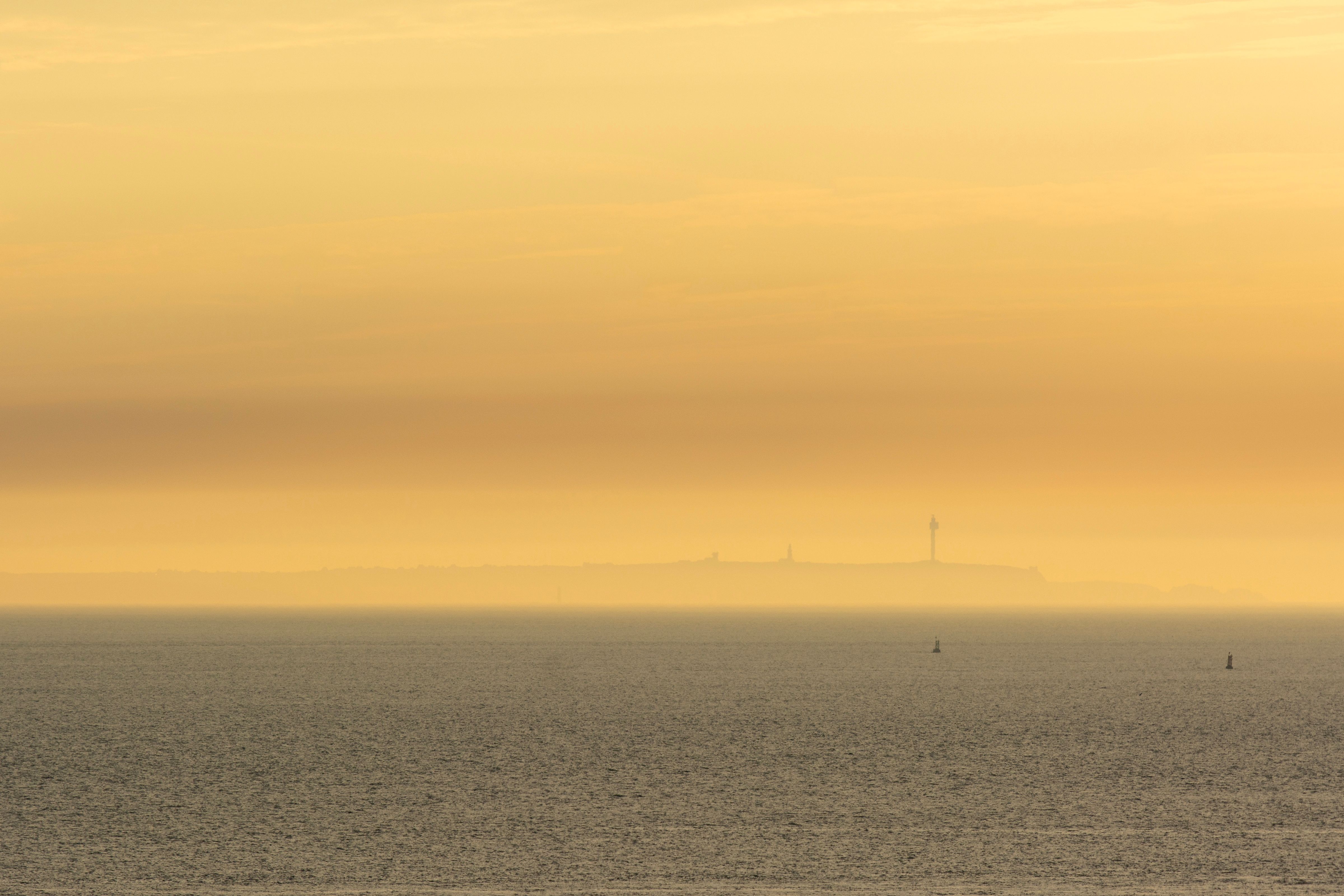 Misty Evening Ocean View with Distant Island · Free Stock Photo