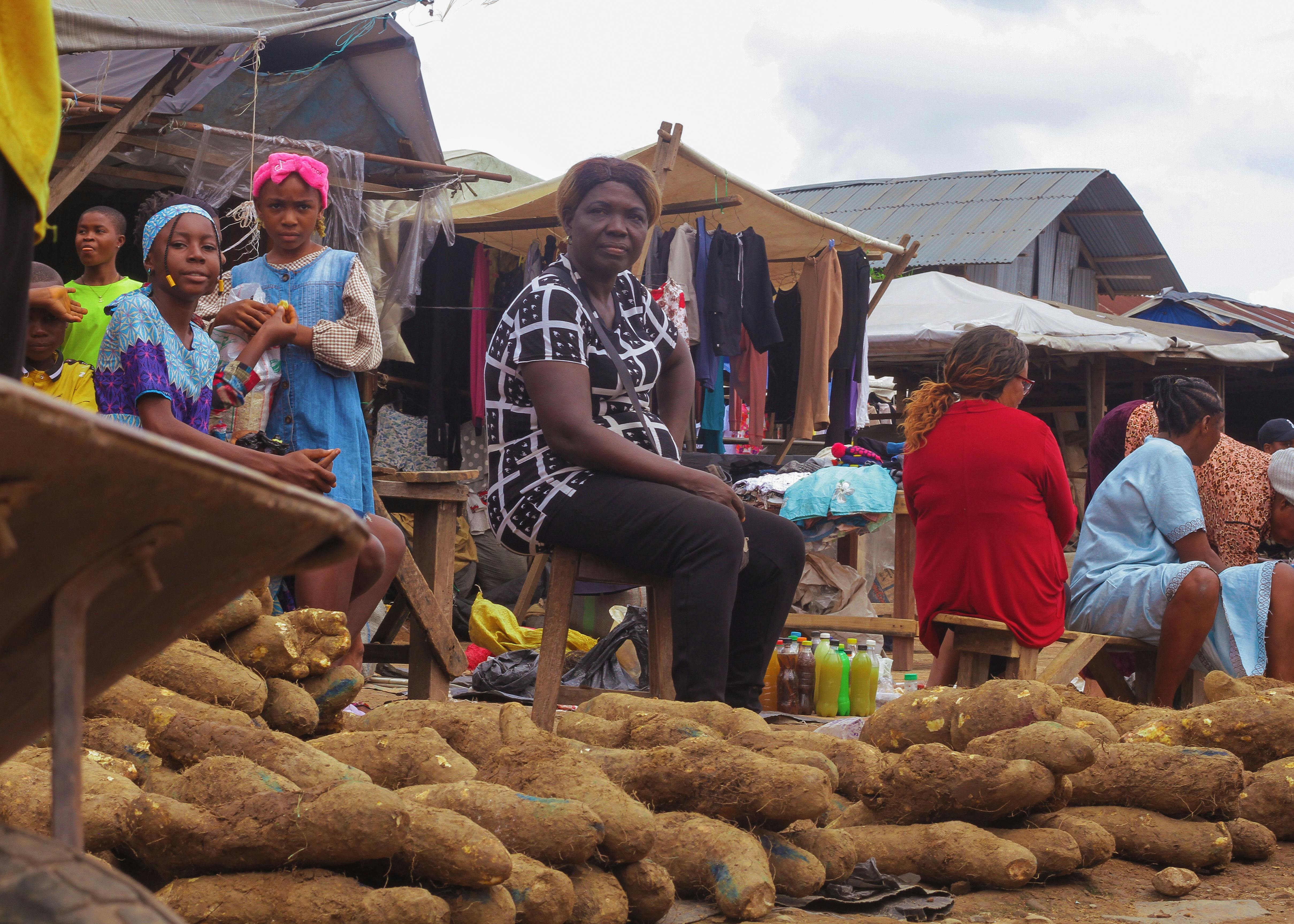 Vibrant African Local Market Scene with Vendors · Free Stock Photo
