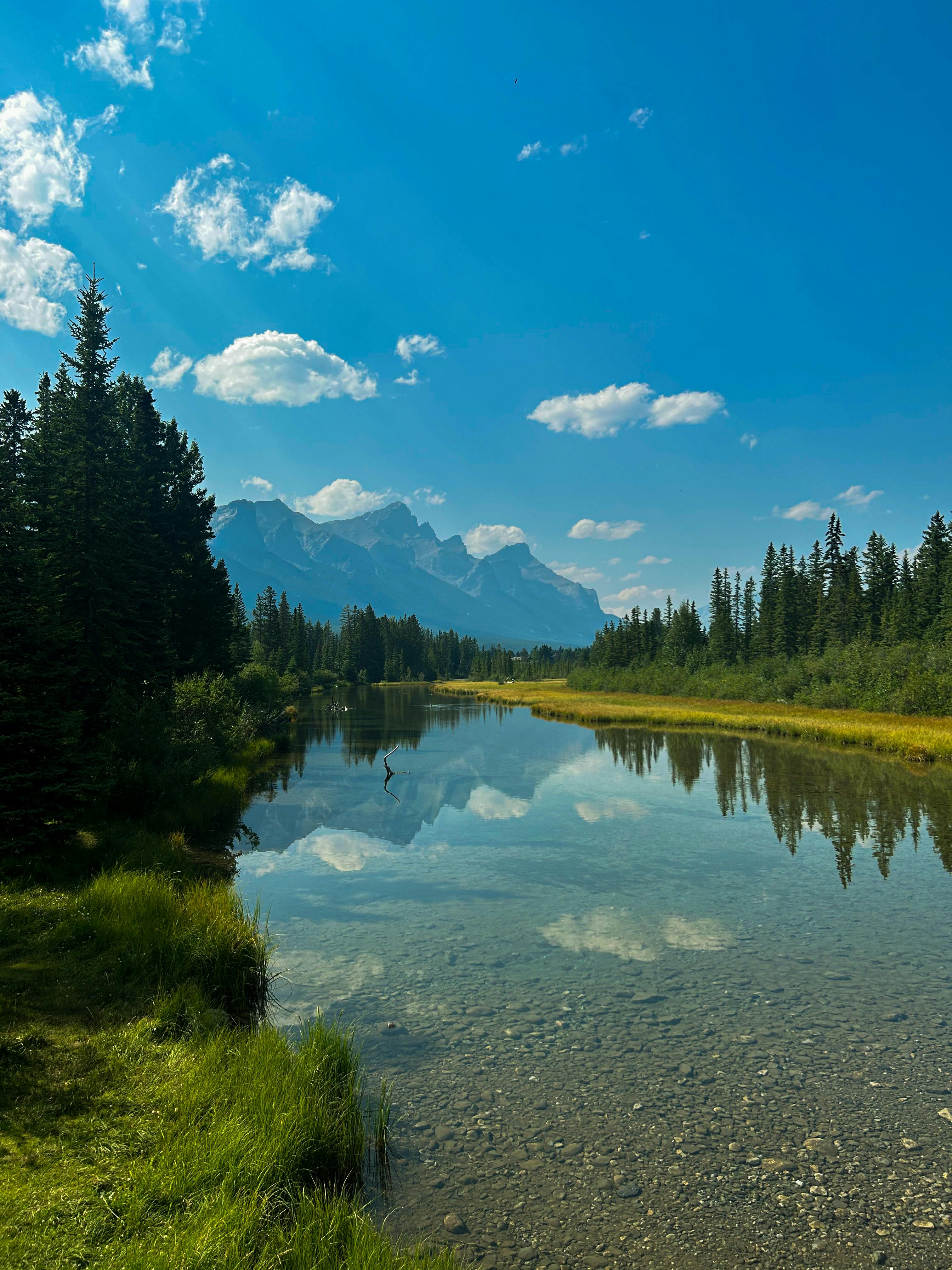 Serene River and Mountain Landscape Reflection · Free Stock Photo