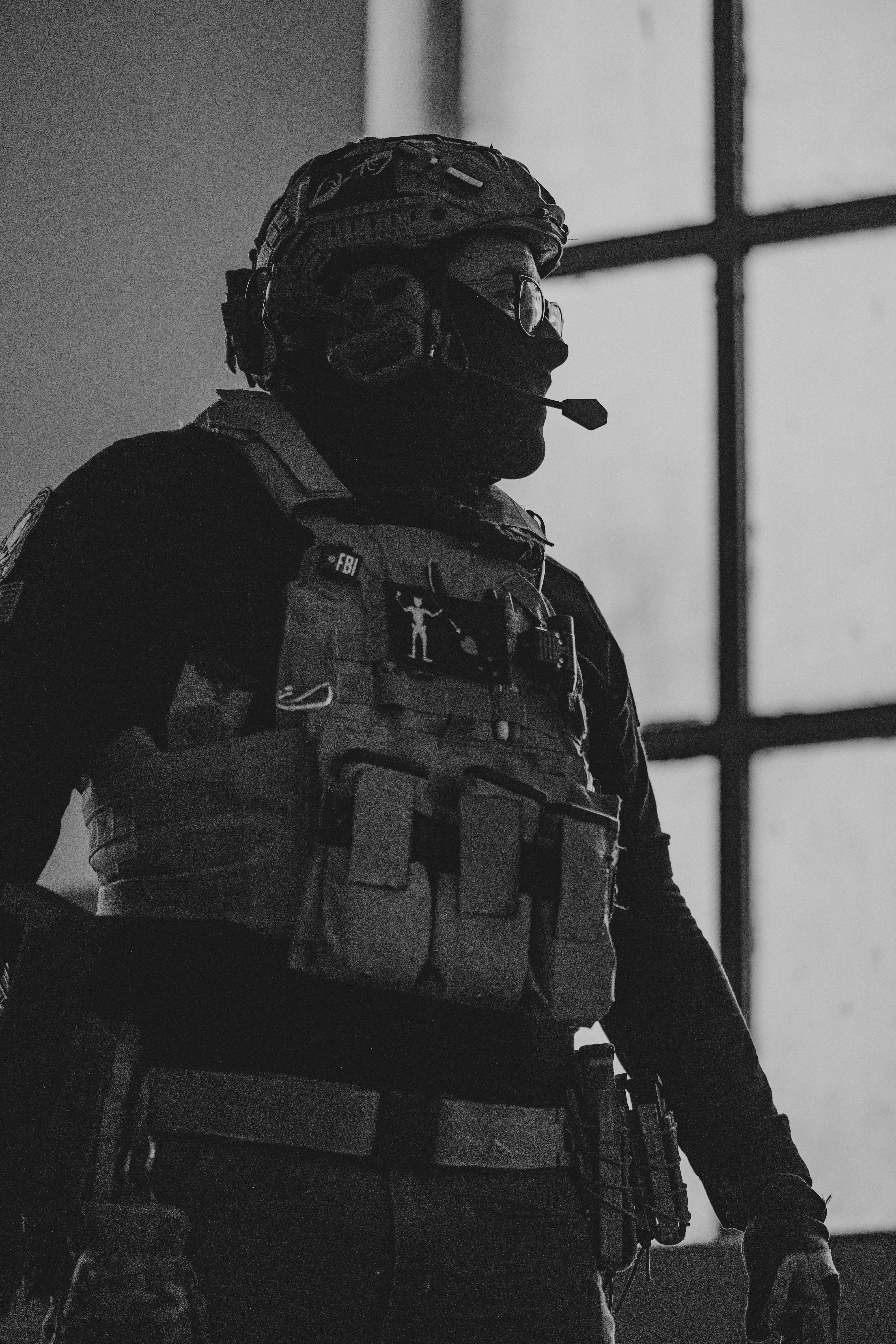 Tactical Soldier Standing Indoors in Monochrome · Free Stock Photo
