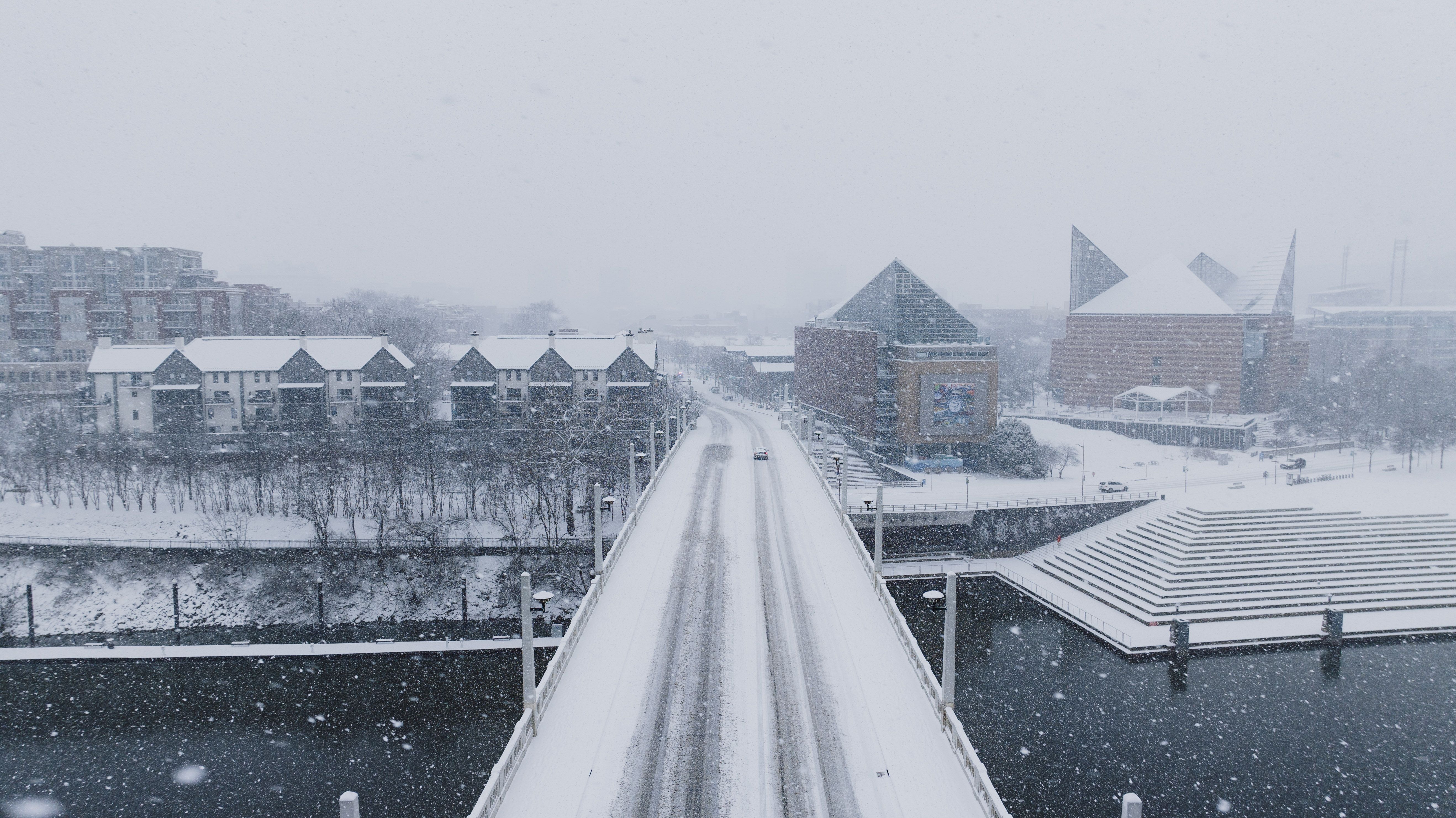 Snowy Bridge and Modern Architecture in Winter · Free Stock Photo