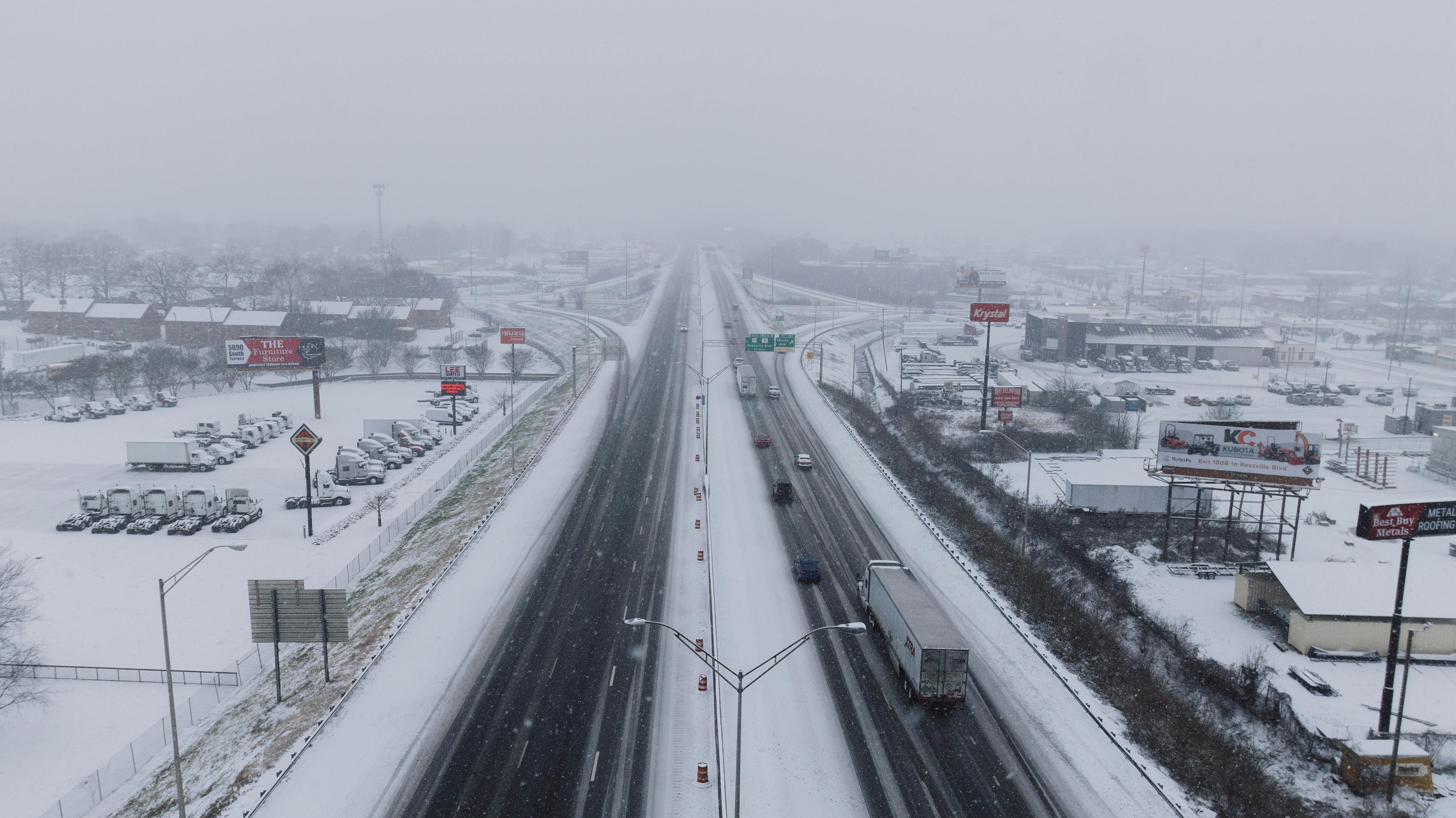 Aerial View of Snow-Covered Highway in Winter · Free Stock Photo