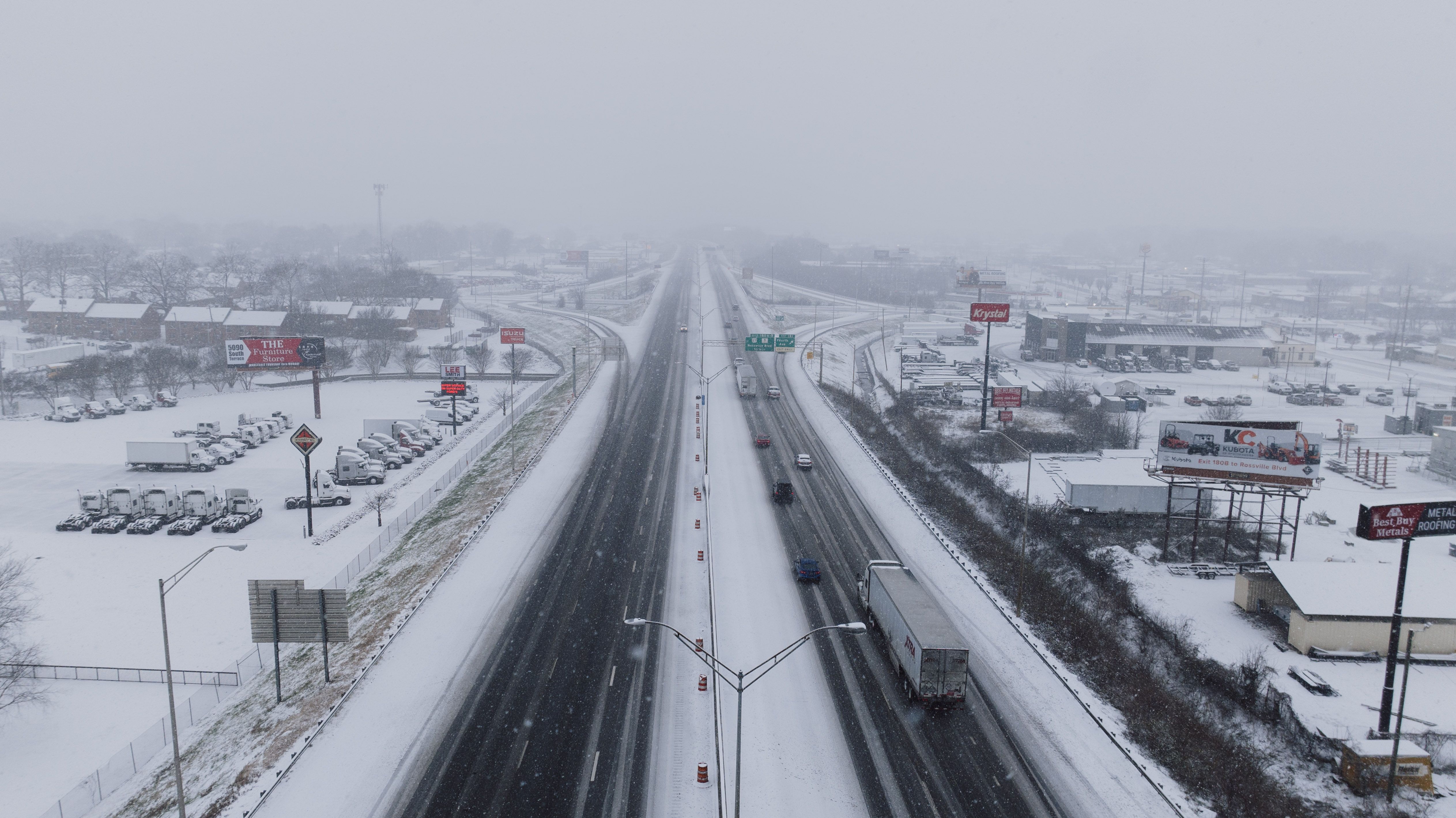 Aerial View of Snow-Covered Highway in Winter · Free Stock Photo
