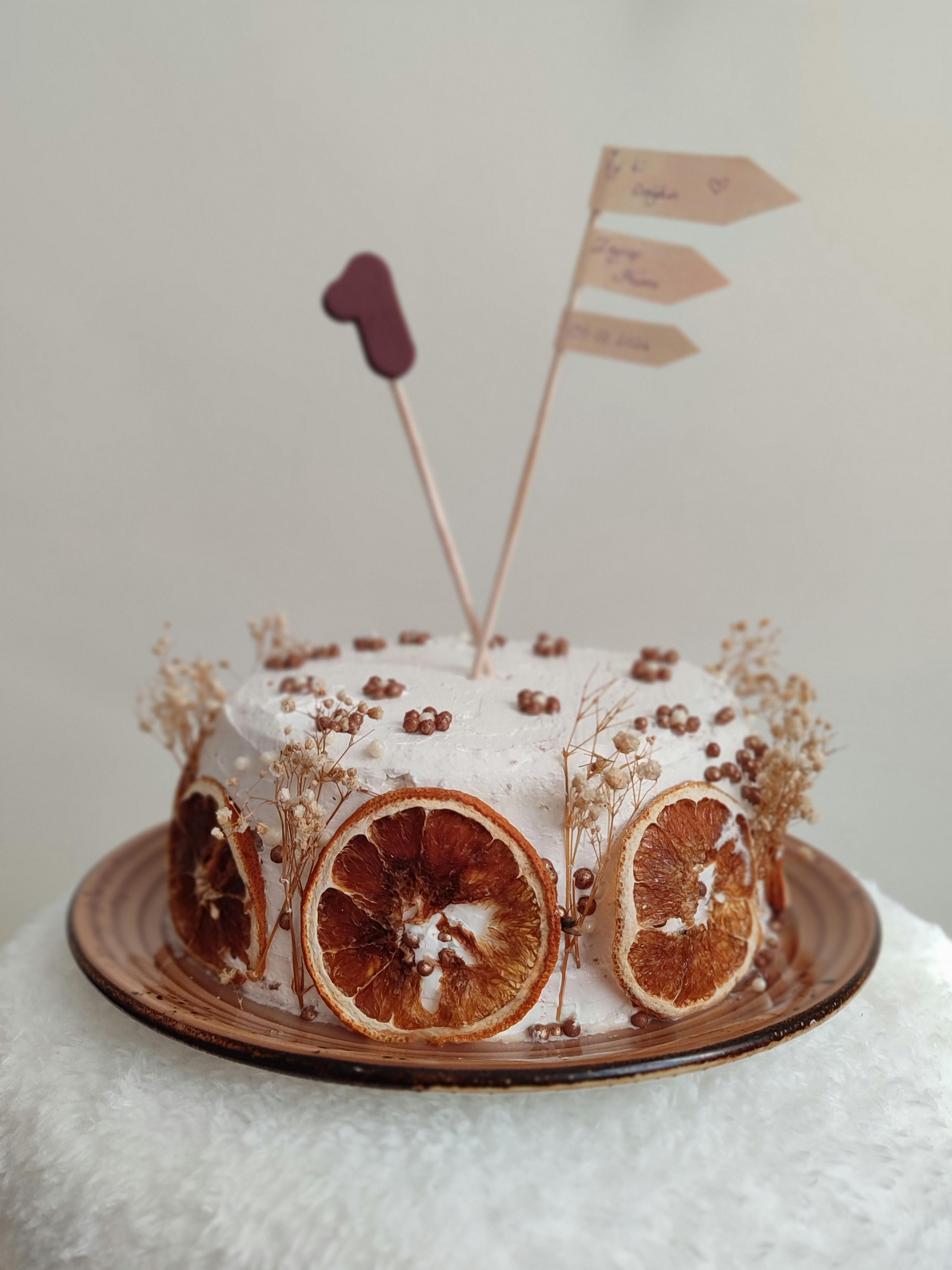 Rustic Citrus Cake with Dried Oranges and Flags · Free Stock Photo