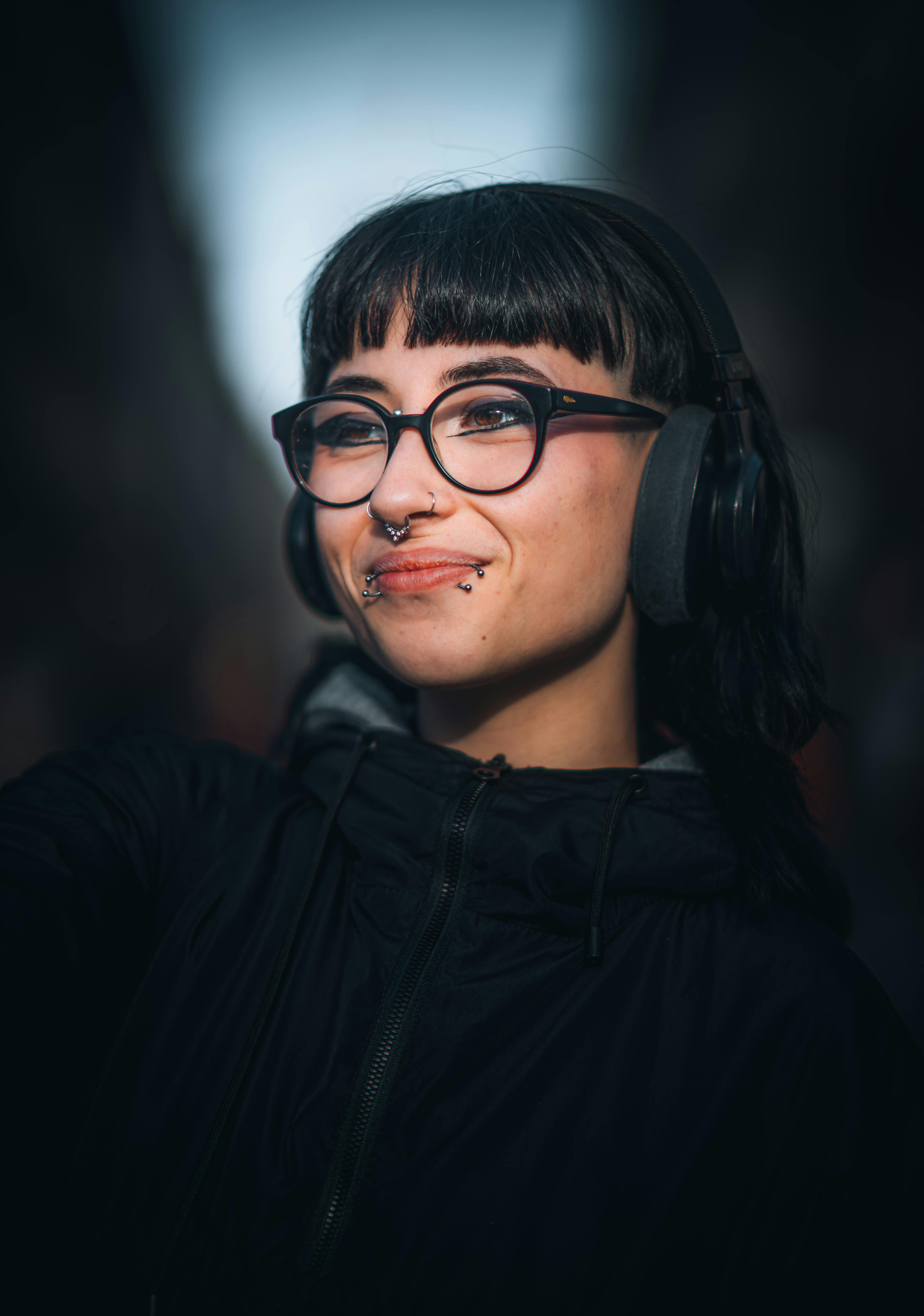 Portrait of Smiling Young Woman with Piercings · Free Stock Photo