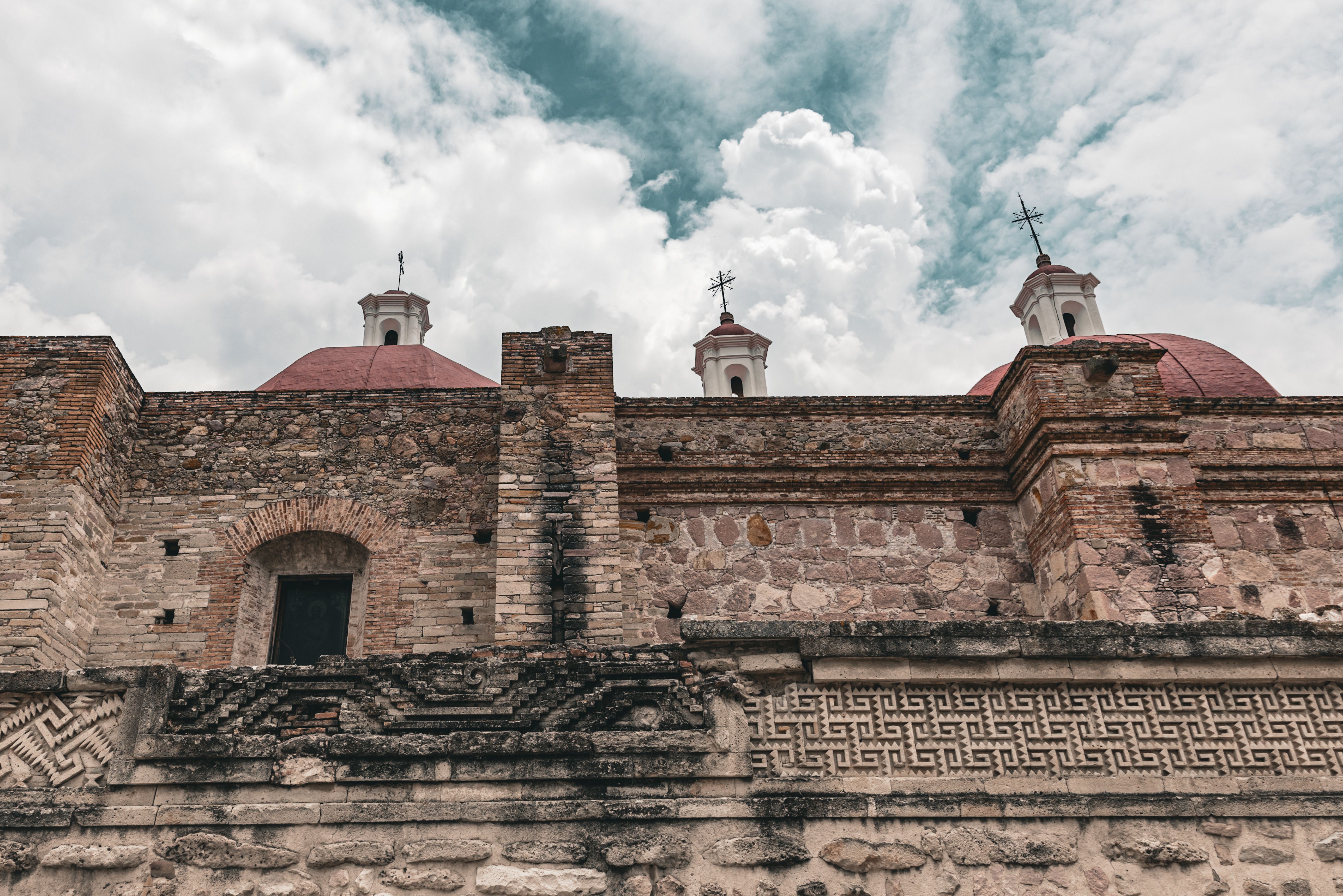 Historic Zapotec Ruins with Red Domes and Stonework · Free Stock Photo