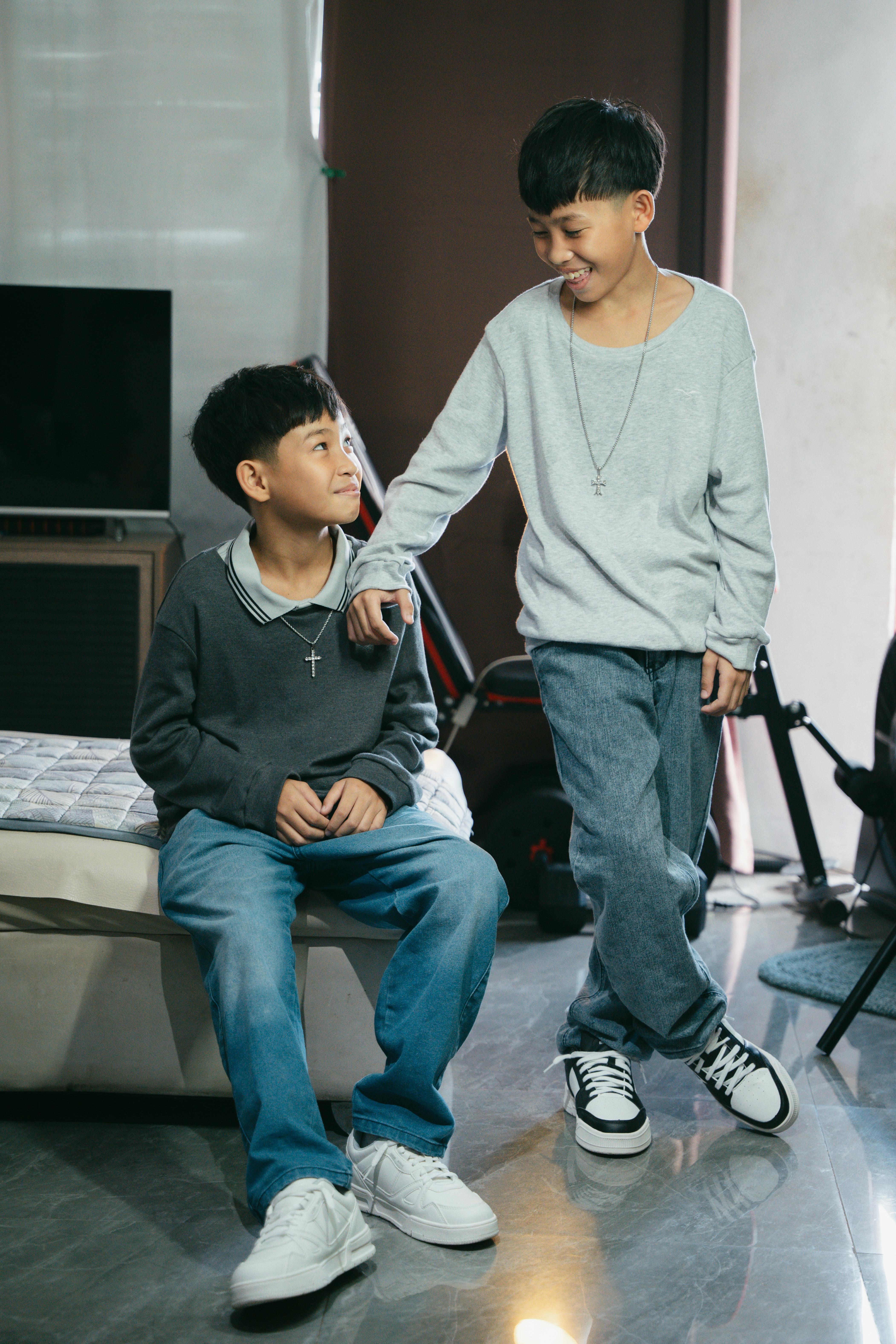 Casual Interaction Between Two Kids Indoors · Free Stock Photo