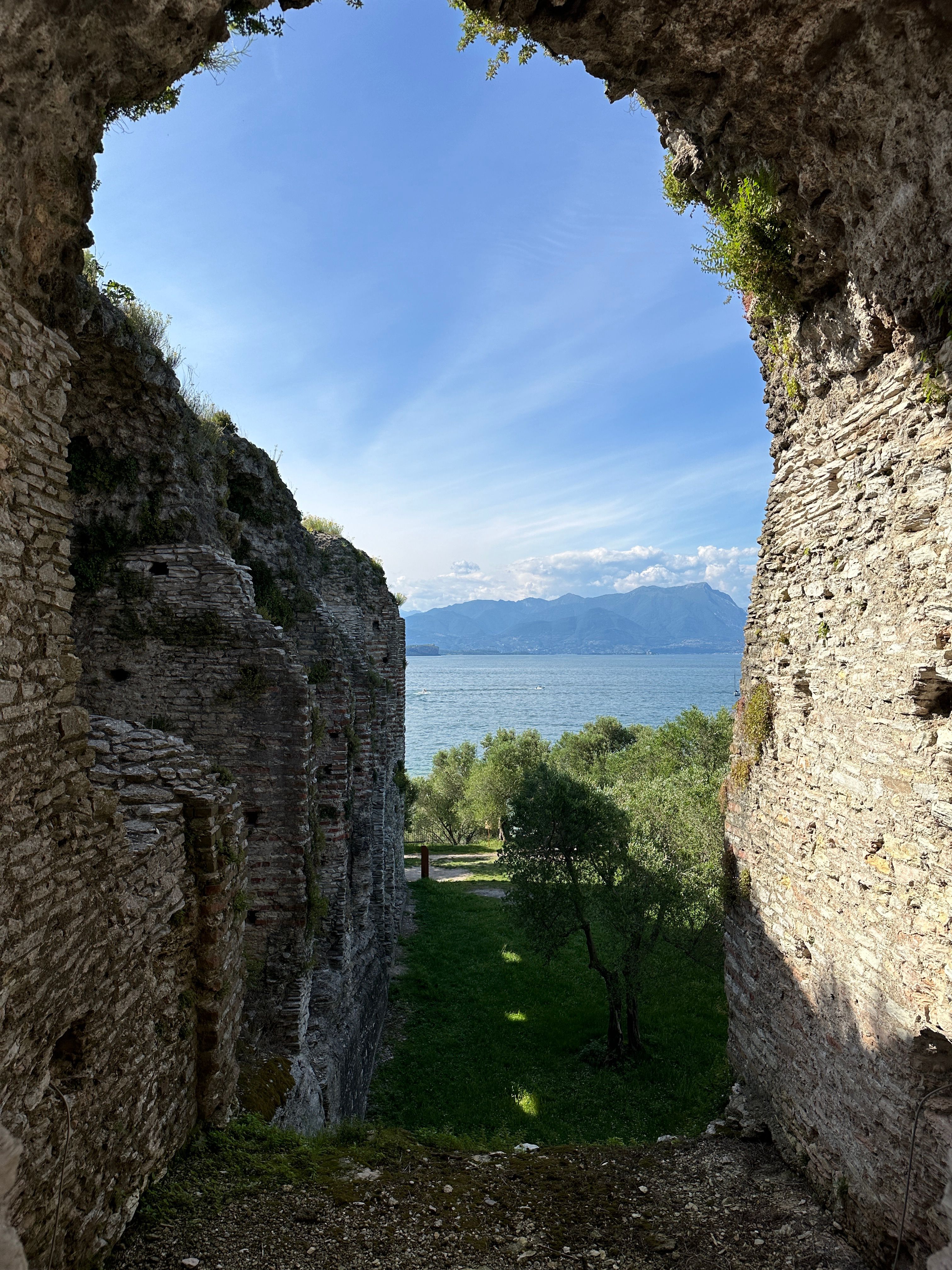Scenic View Through Ancient Stone Archway · Free Stock Photo
