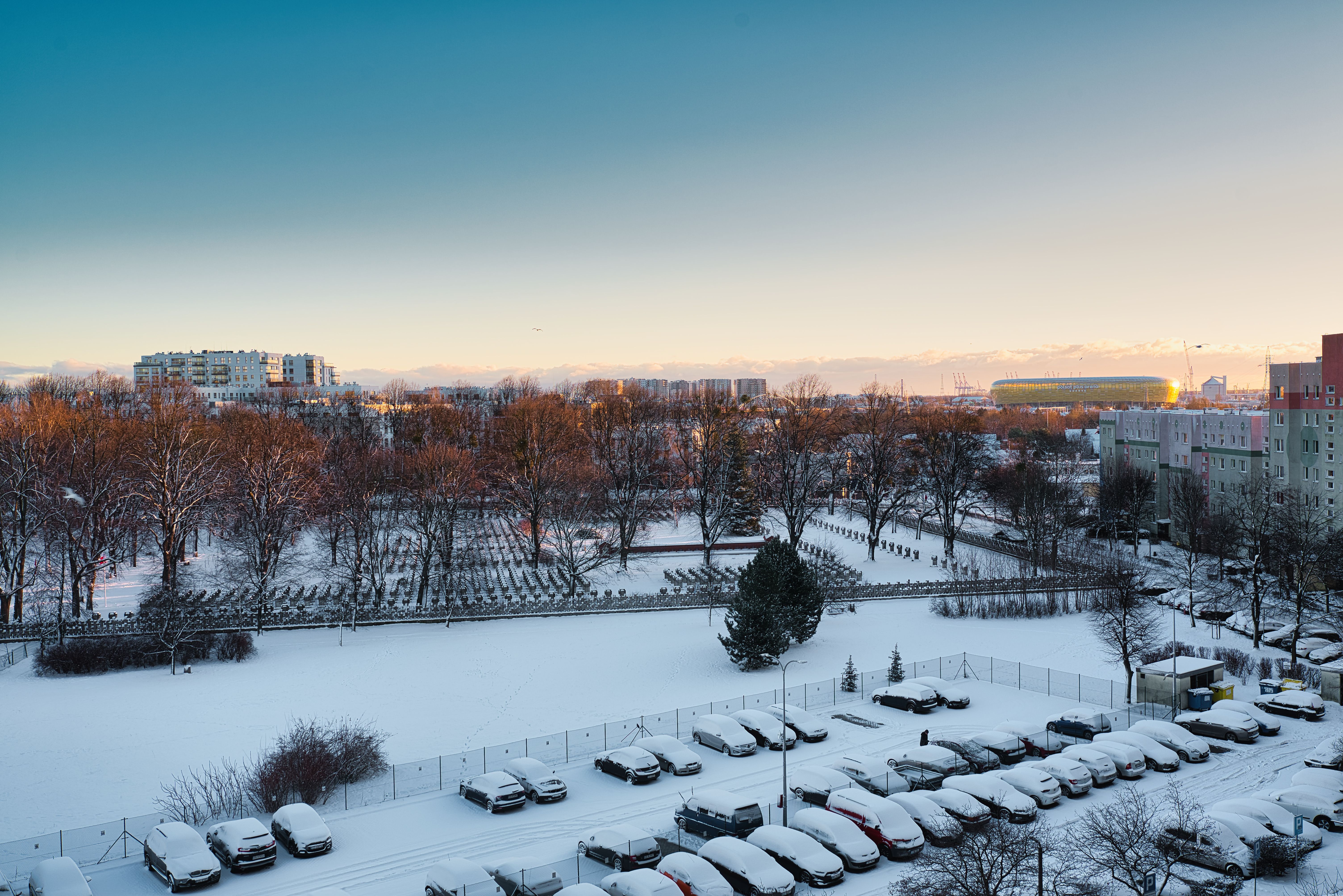 Snow-Covered Urban Park Under Winter Sunset · Free Stock Photo