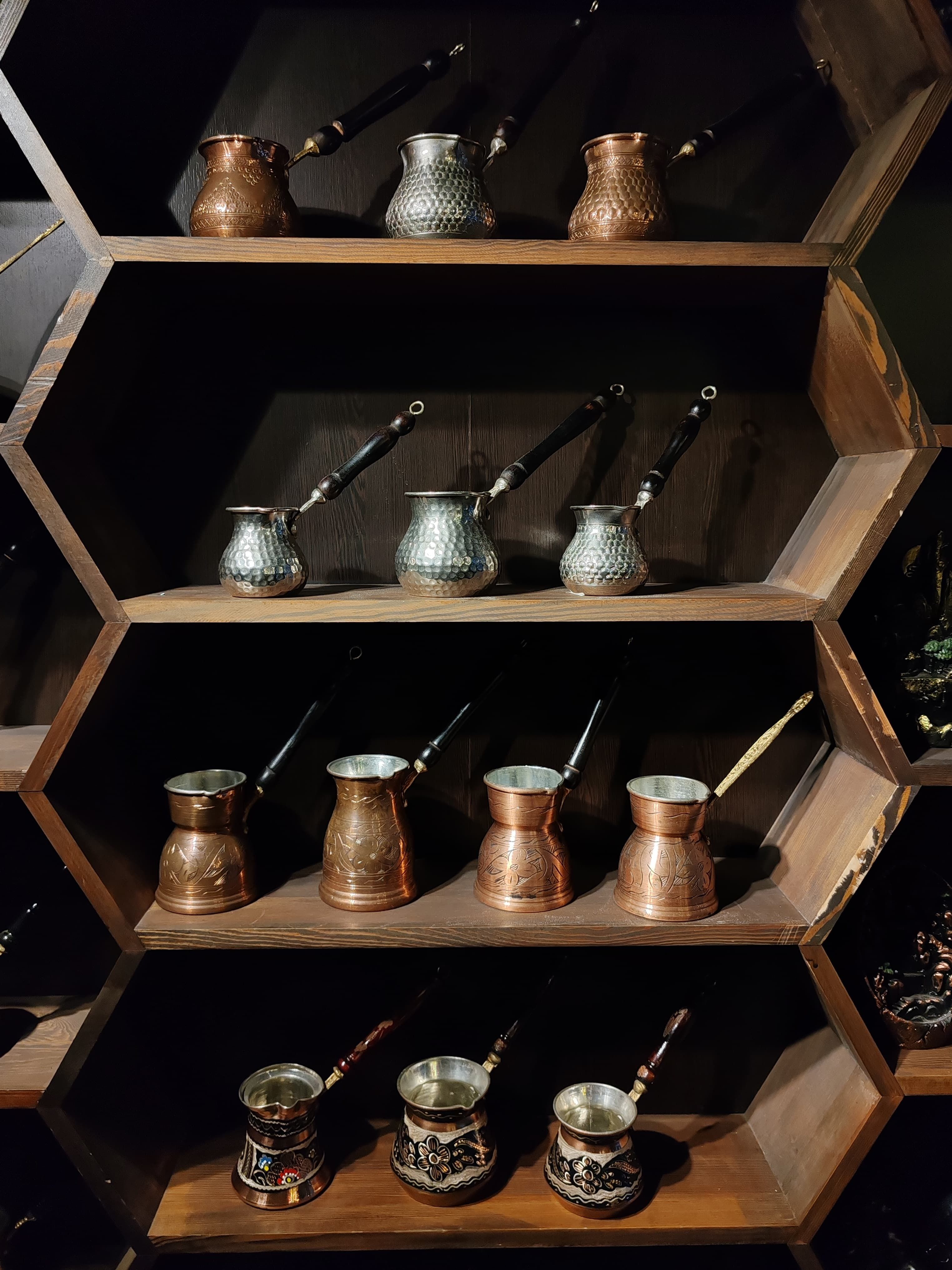 Traditional Copper Coffee Pots on Wooden Shelf · Free Stock Photo