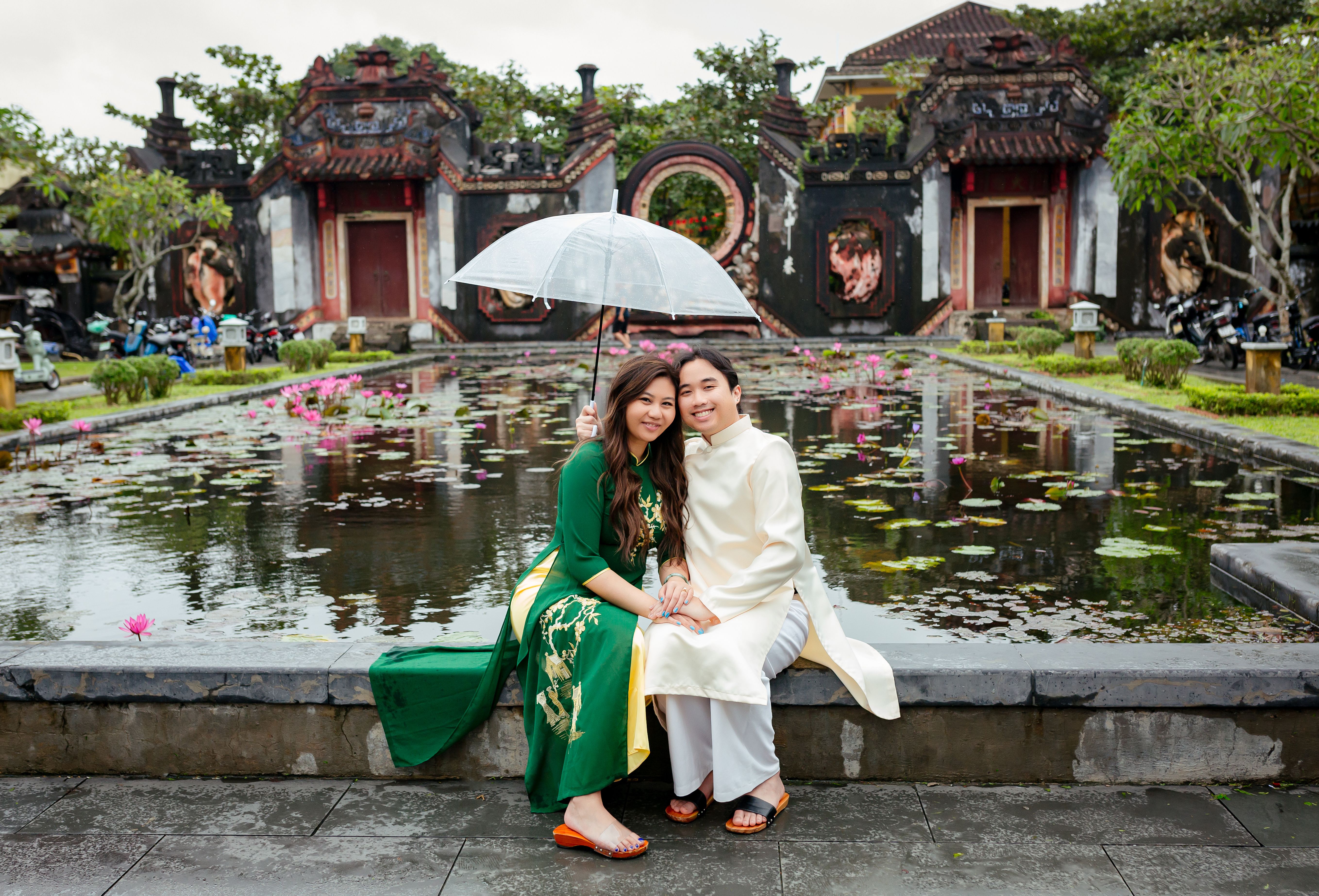 Vietnamese Couple in Traditional Ao Dai at Hoi An Temple · Free Stock Photo