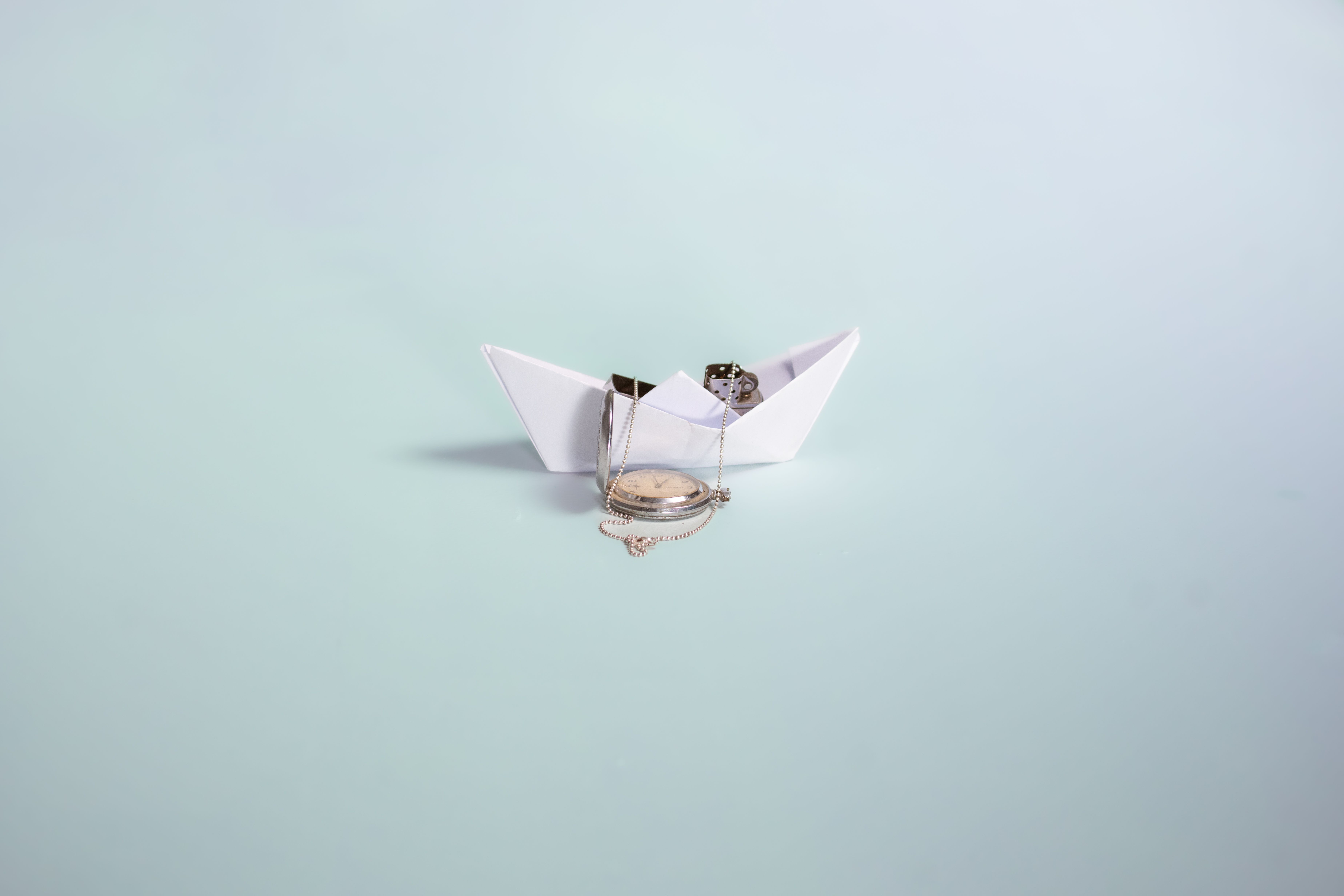 Minimalist Paper Boat with Vintage Pocket Watch · Free Stock Photo