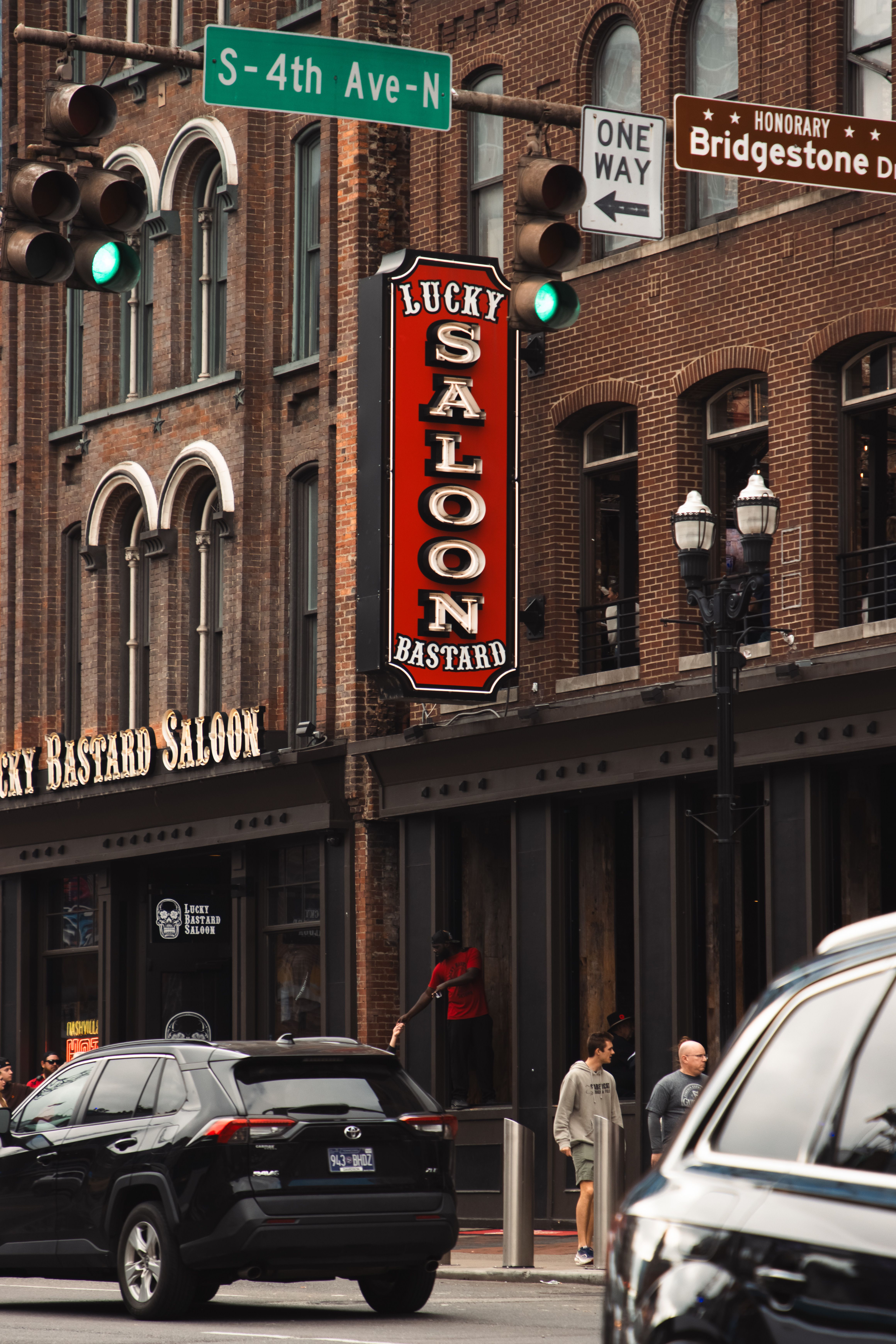 Urban Scene with Lucky Bastard Saloon Sign · Free Stock Photo