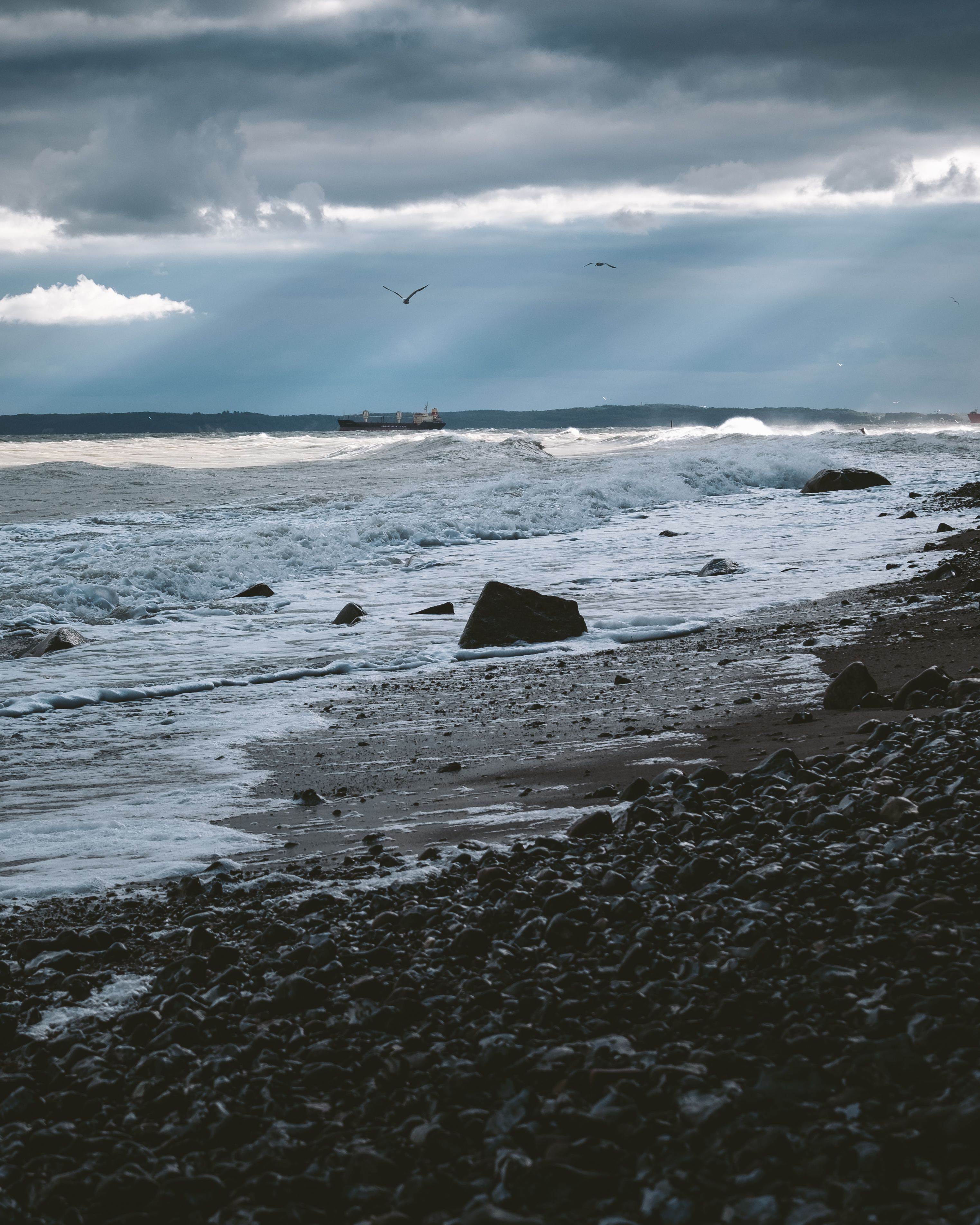 Dramatic Baltic Sea Shoreline with Cloudy Skies · Free Stock Photo