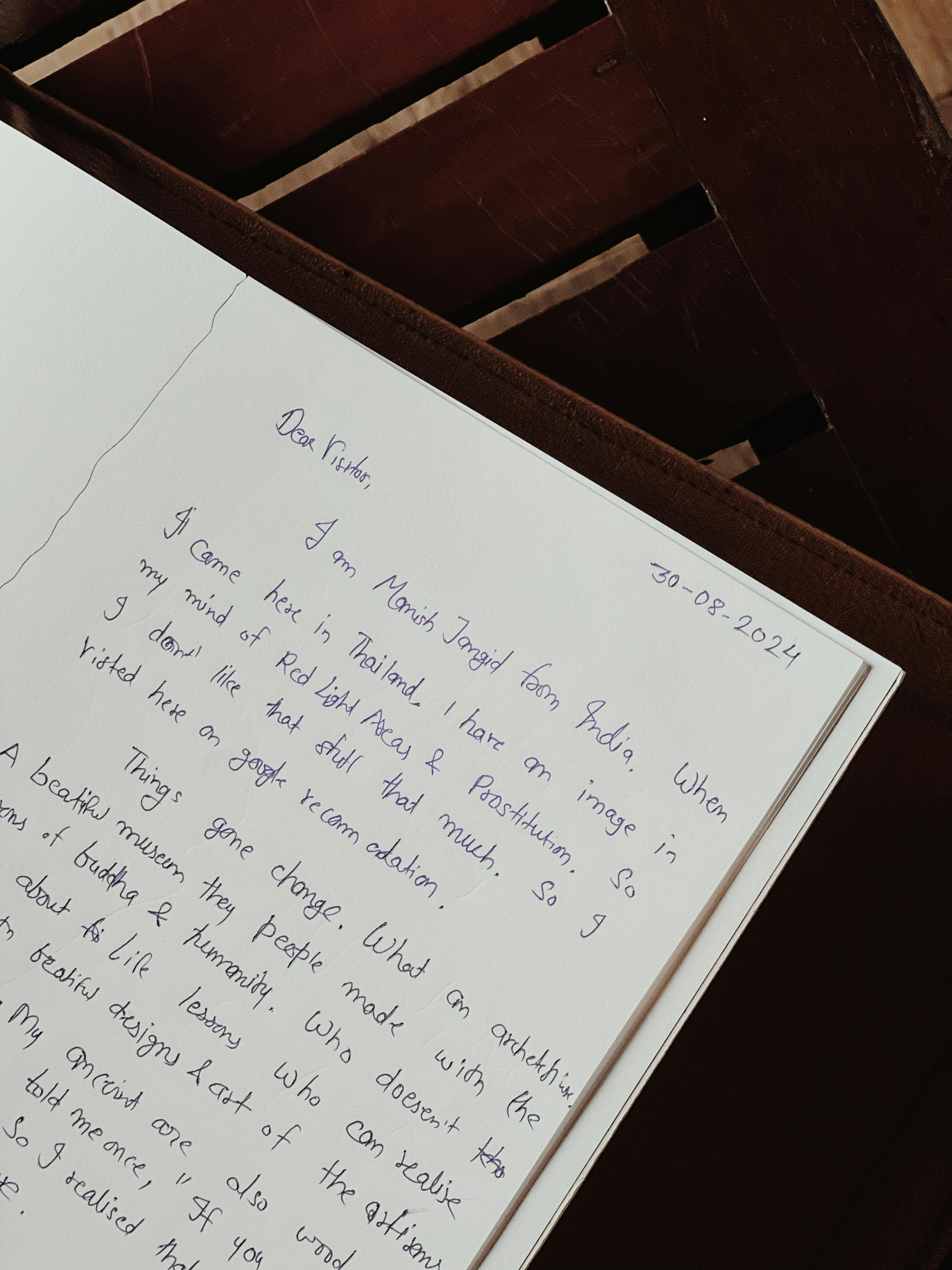 Handwritten Journal Entry on Open Book · Free Stock Photo