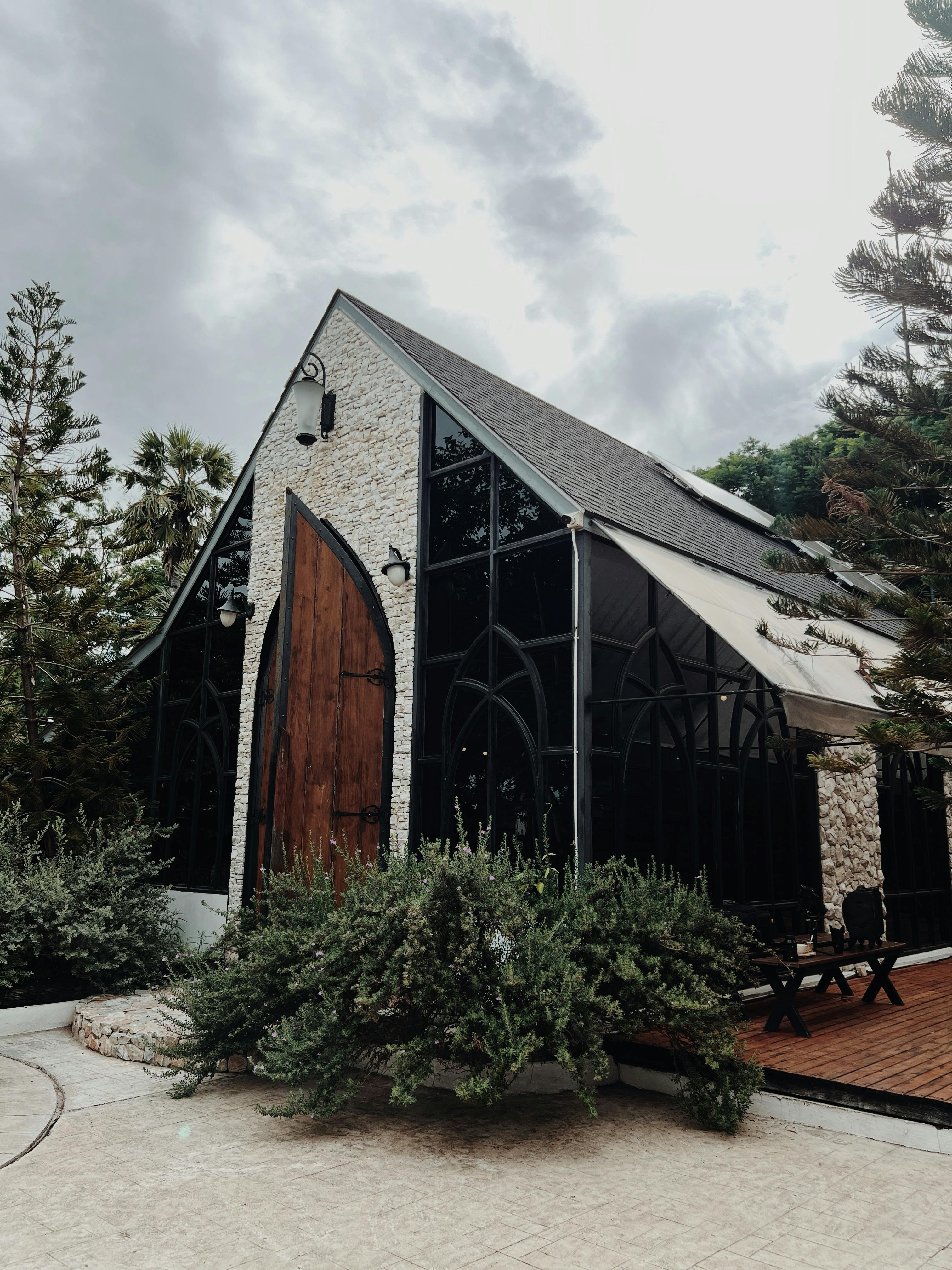 Rustic Chapel Surrounded by Lush Greenery · Free Stock Photo