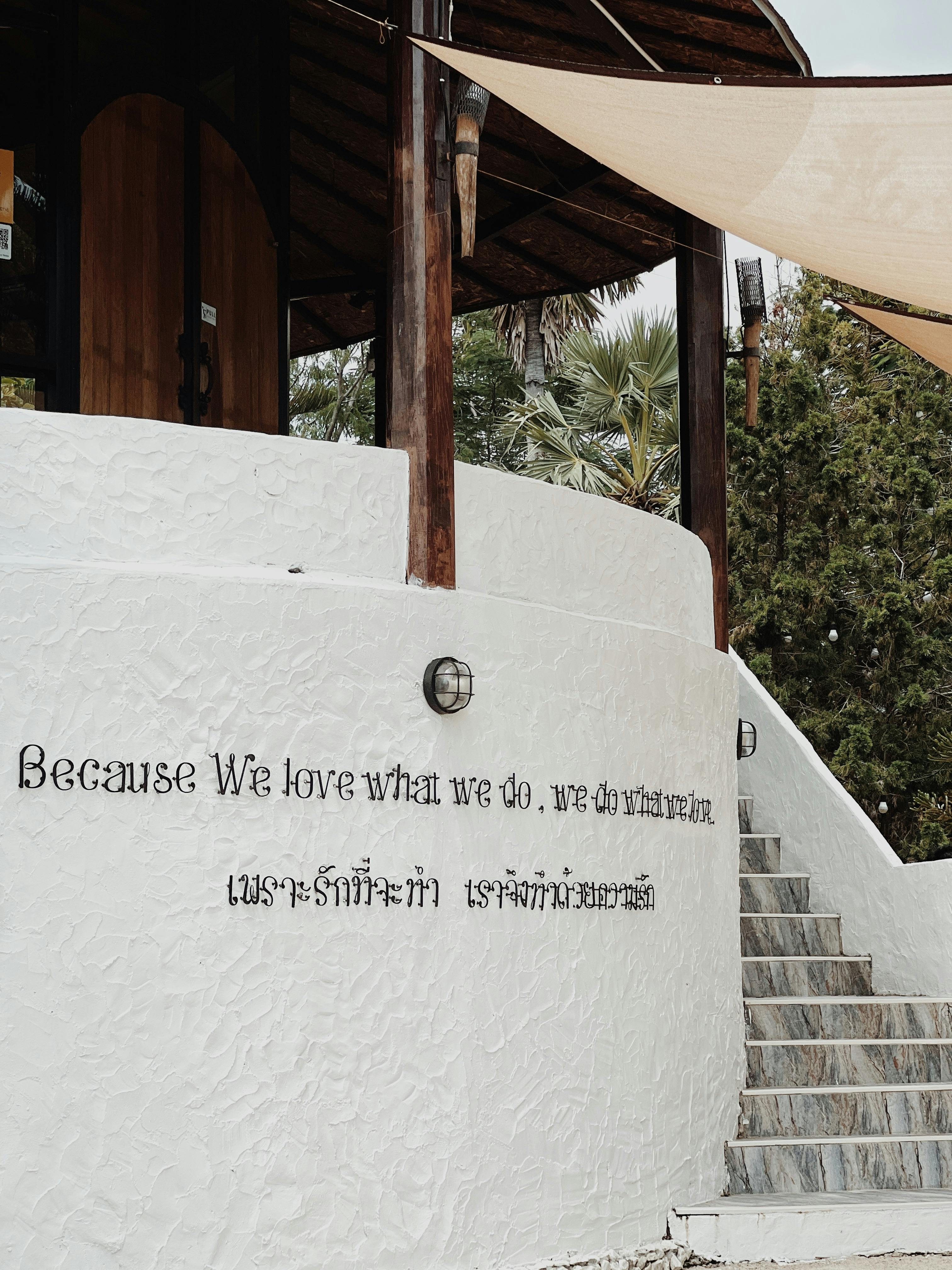 Rustic Building with Inspirational Quote on Stairway Wall · Free Stock ...