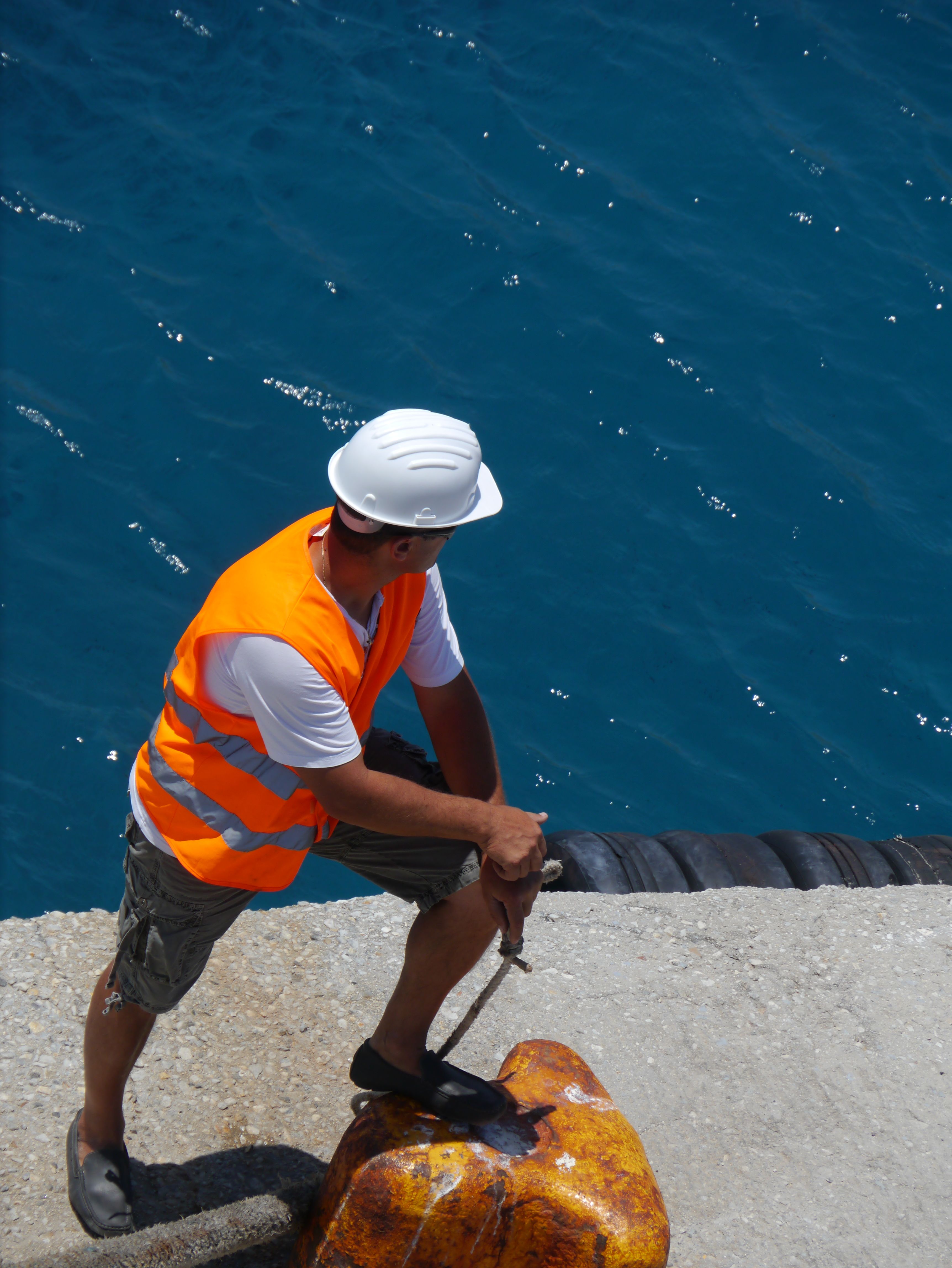 Construction Worker on Pier by the Sea · Free Stock Photo