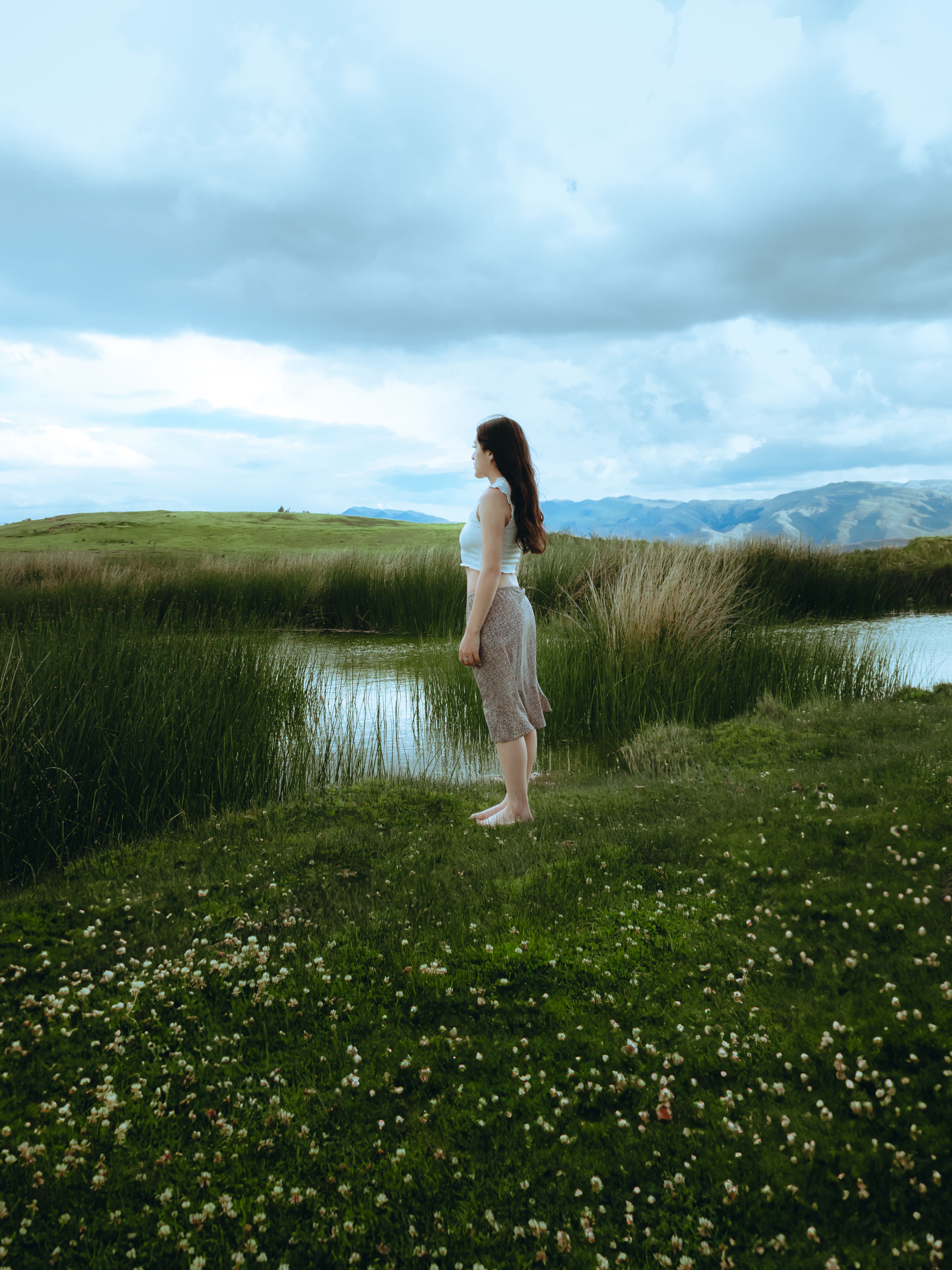Tranquil Woman Gazing at Serene Lake in Nature · Free Stock Photo