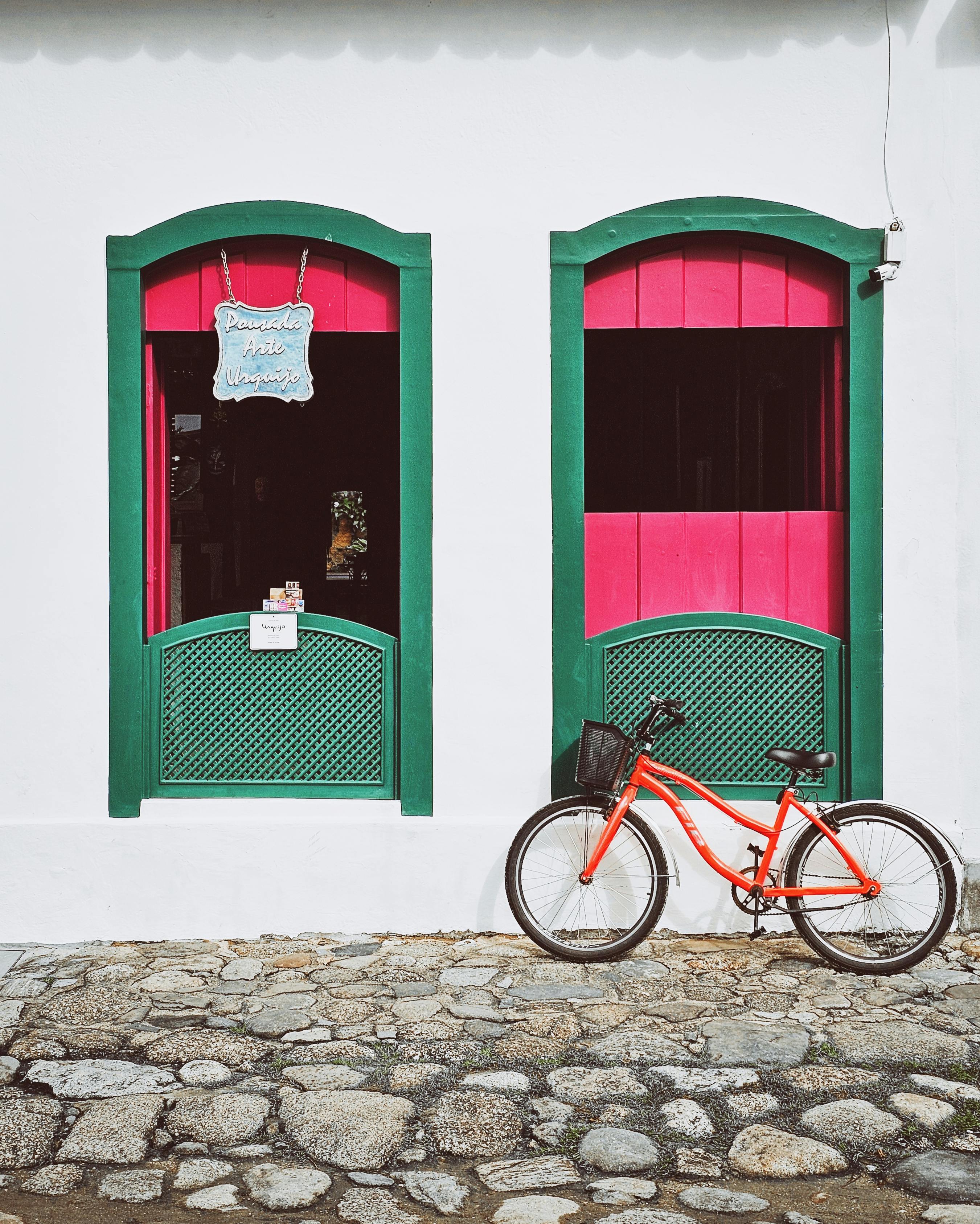 Vibrant Tropical Storefront with Bicycle · Free Stock Photo