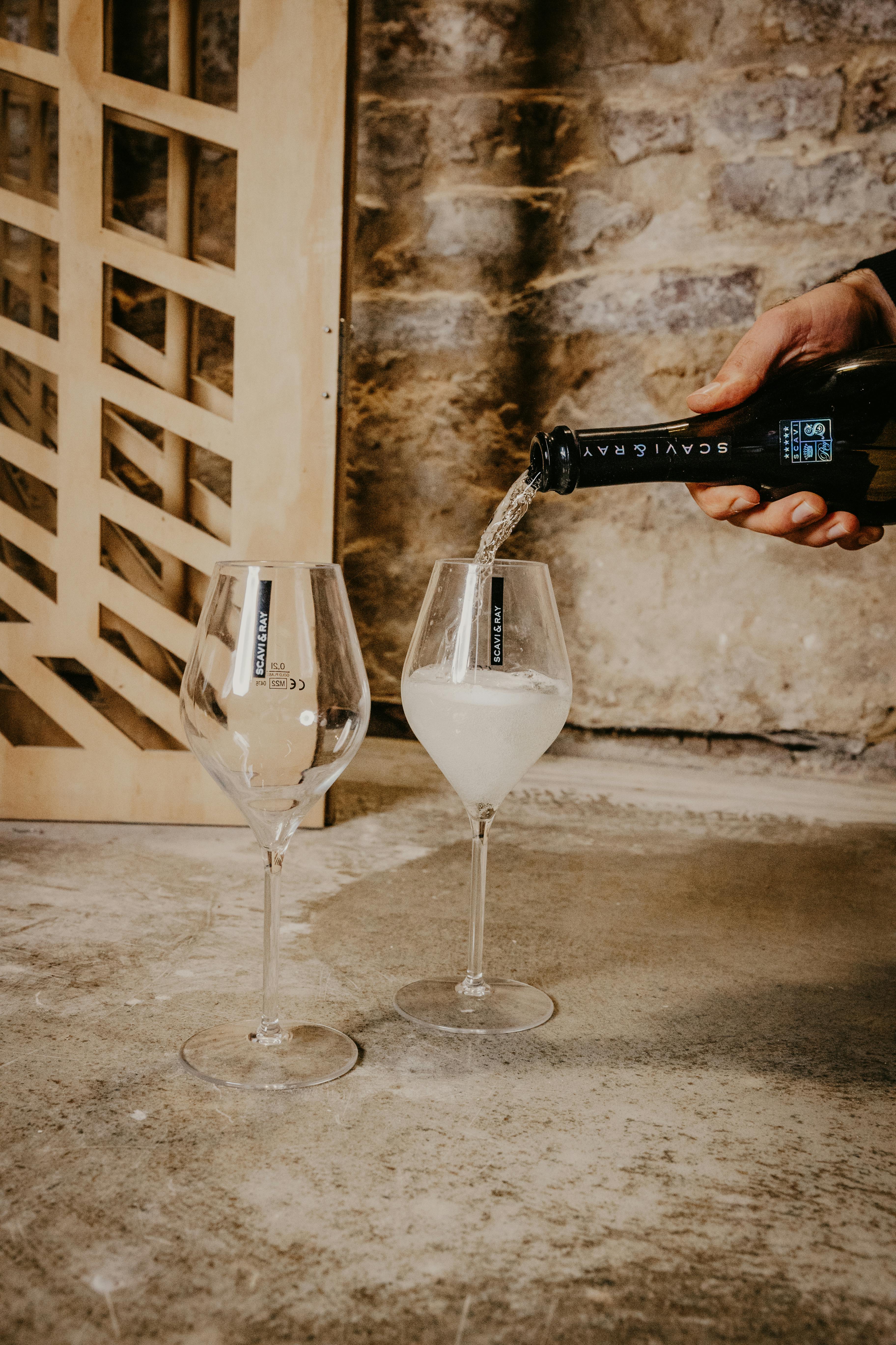 Pouring Prosecco in Elegant Wine Glasses · Free Stock Photo