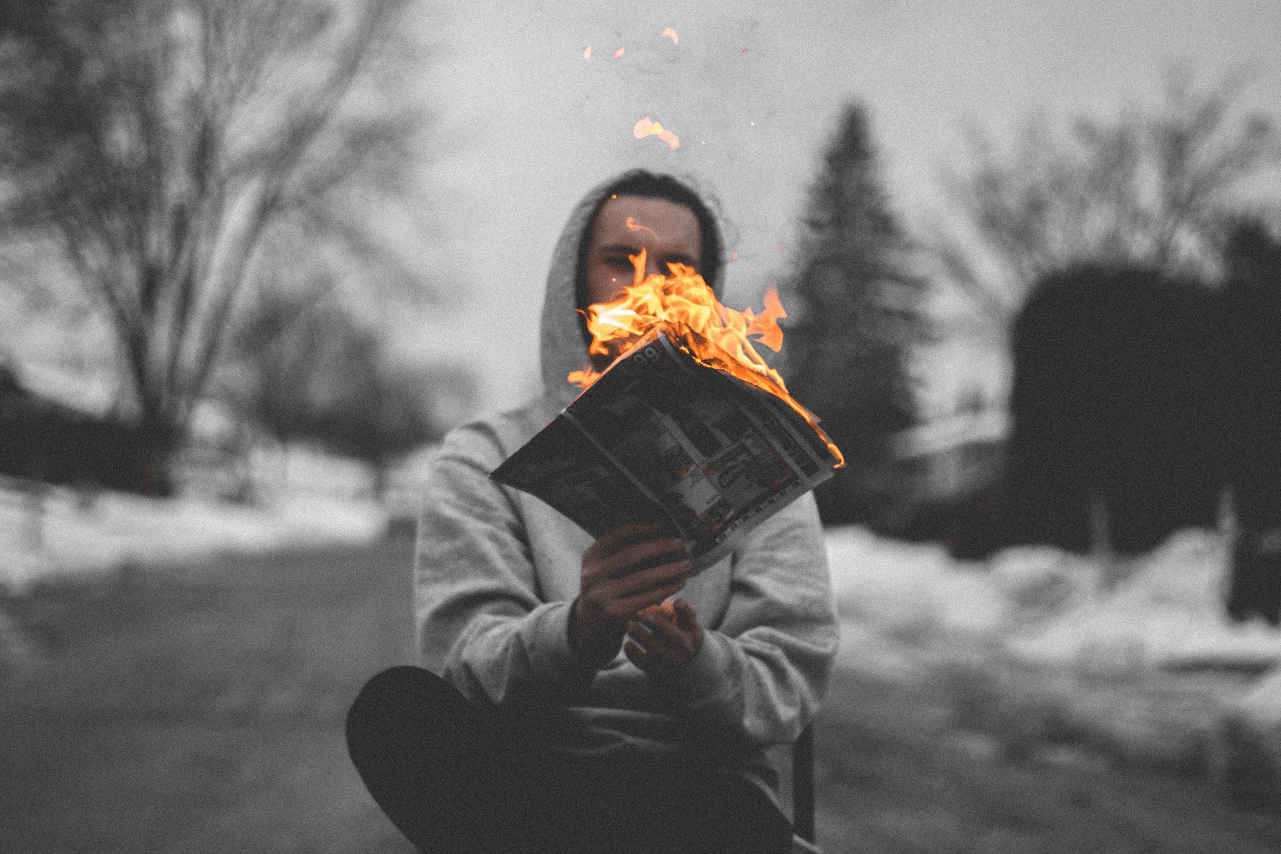 Portrait of an African Man Holding Burning Paper · Free Stock Photo