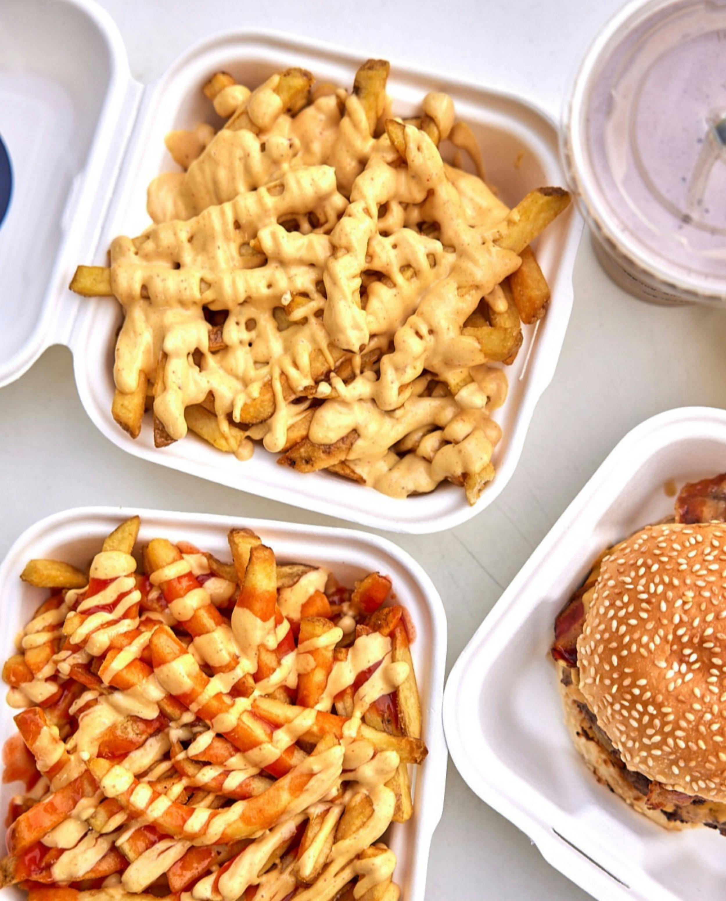 Delicious Fast Food Meal with Fries and Burger · Free Stock Photo