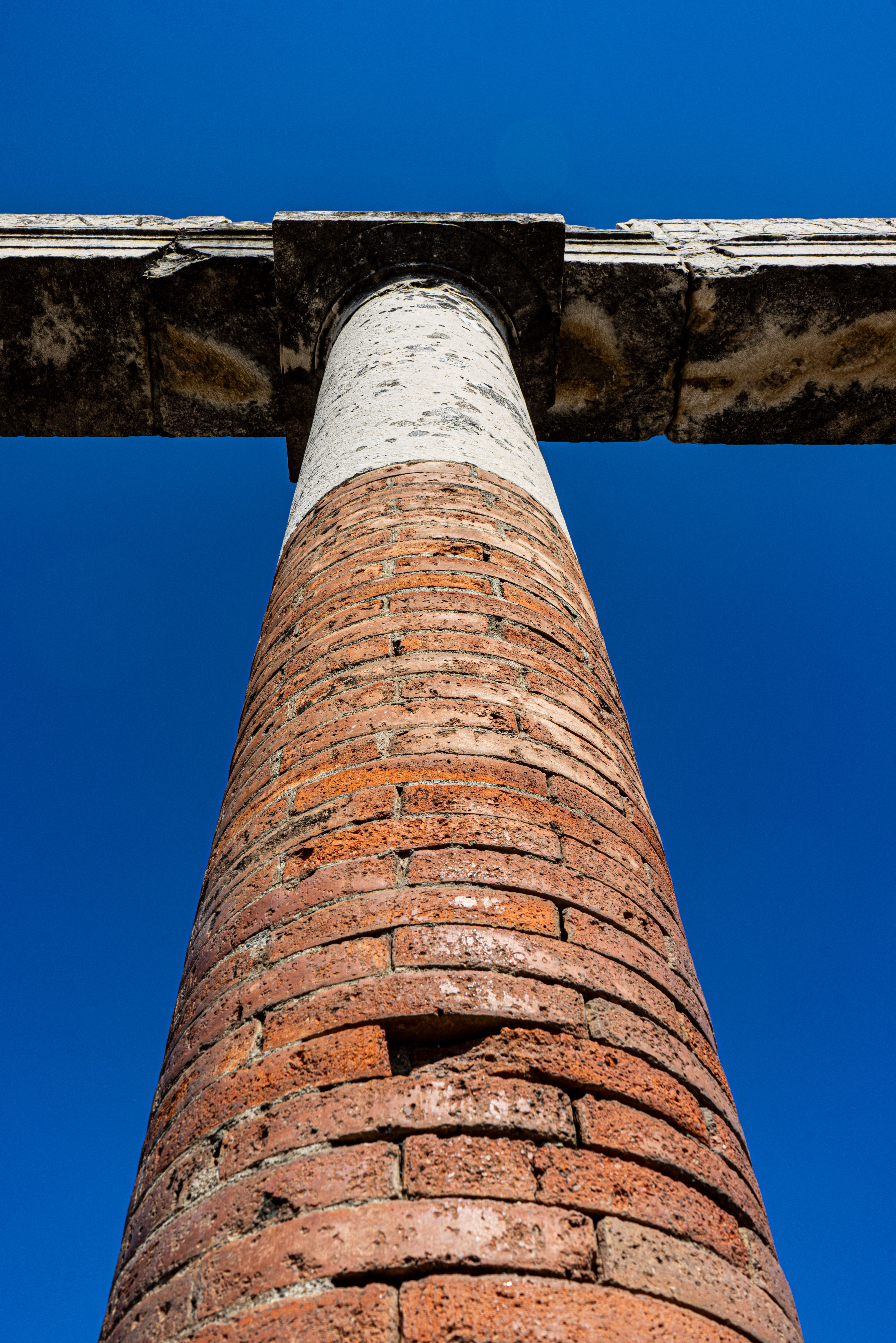 Ancient Brick Column Against Blue Sky in Pompeii · Free Stock Photo