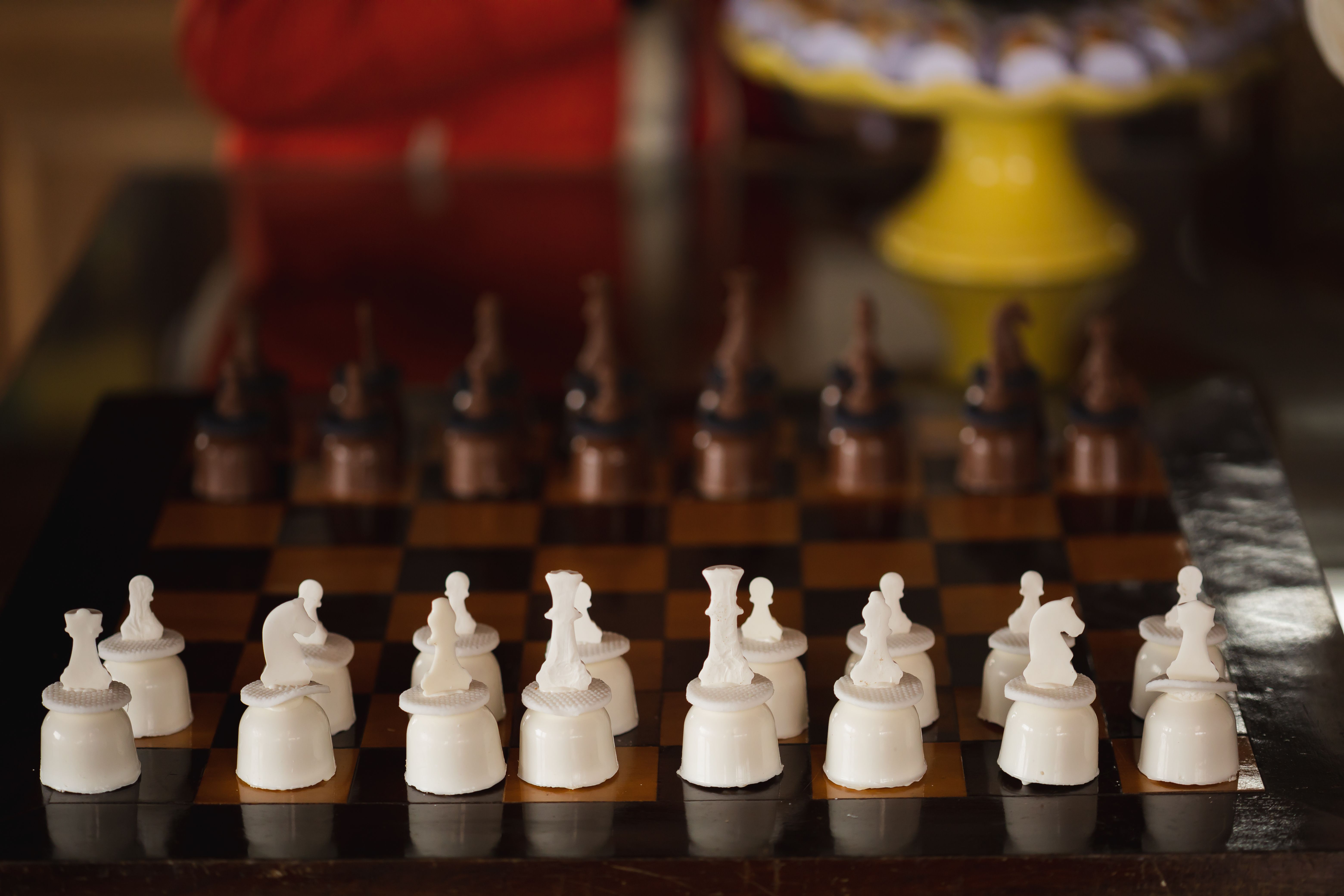 Elegant Chess Game Setup with Chocolate Pieces · Free Stock Photo