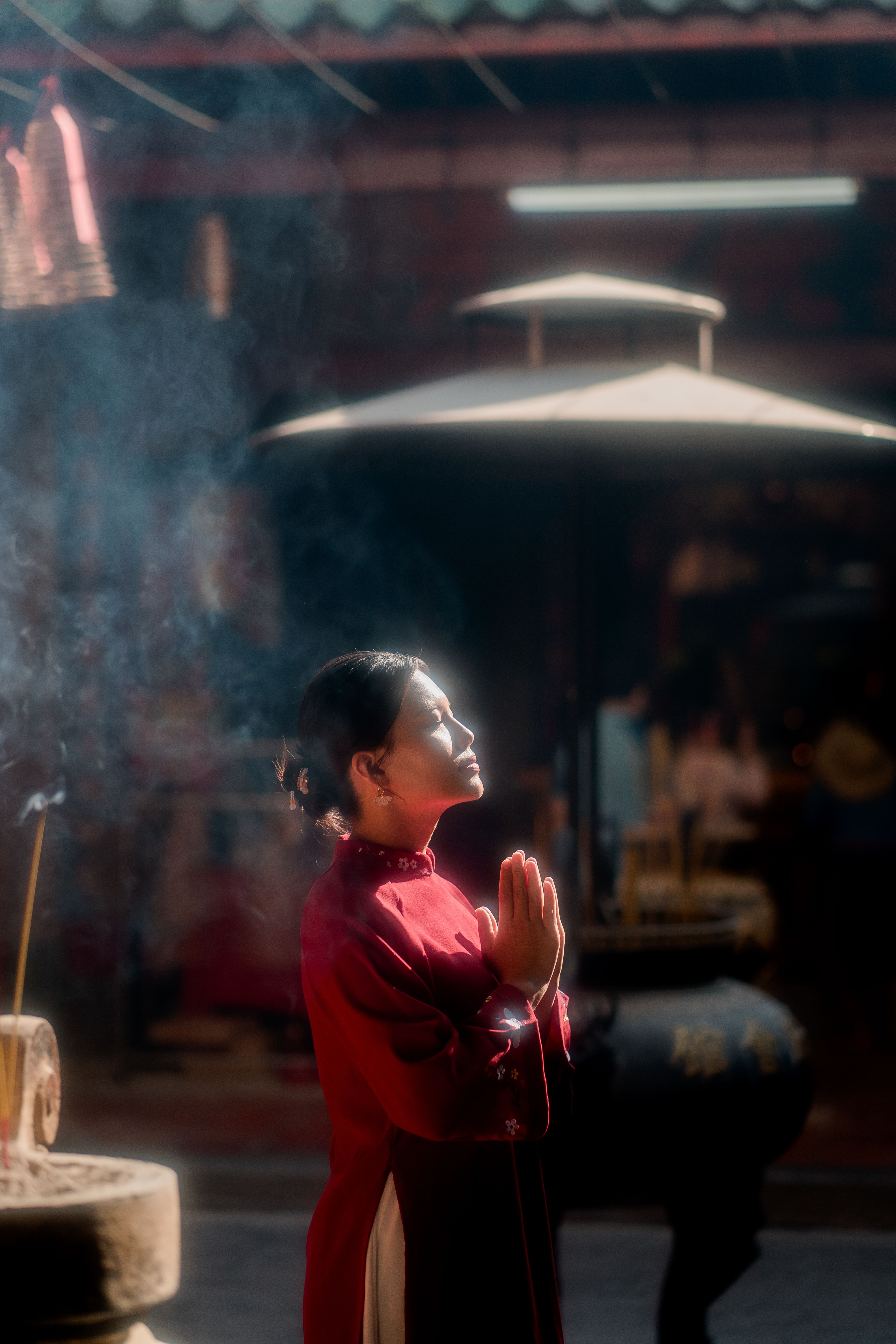 Woman Praying in Spiritual Asian Setting · Free Stock Photo