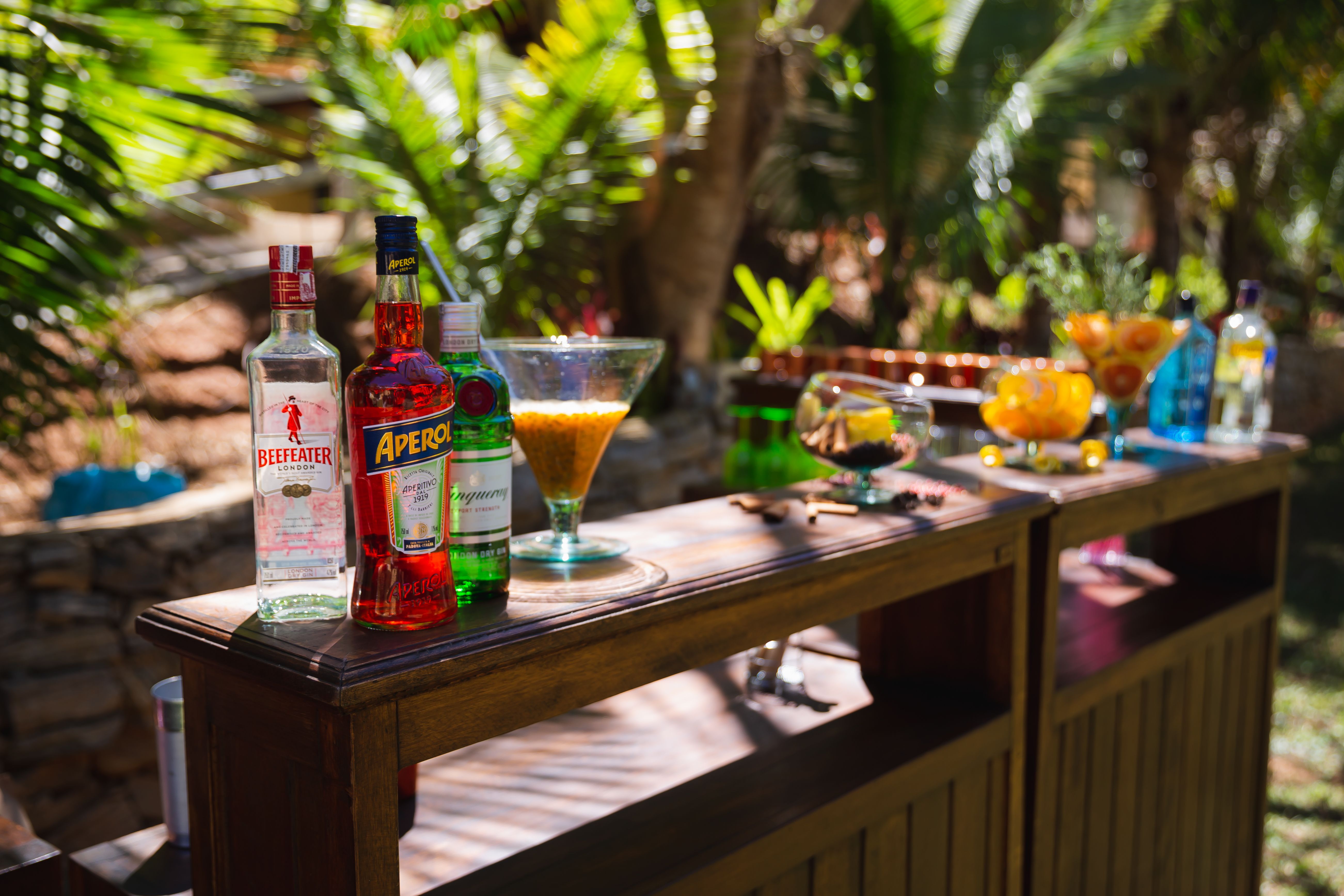 Outdoor Tropical Bar Setup with Bottles · Free Stock Photo