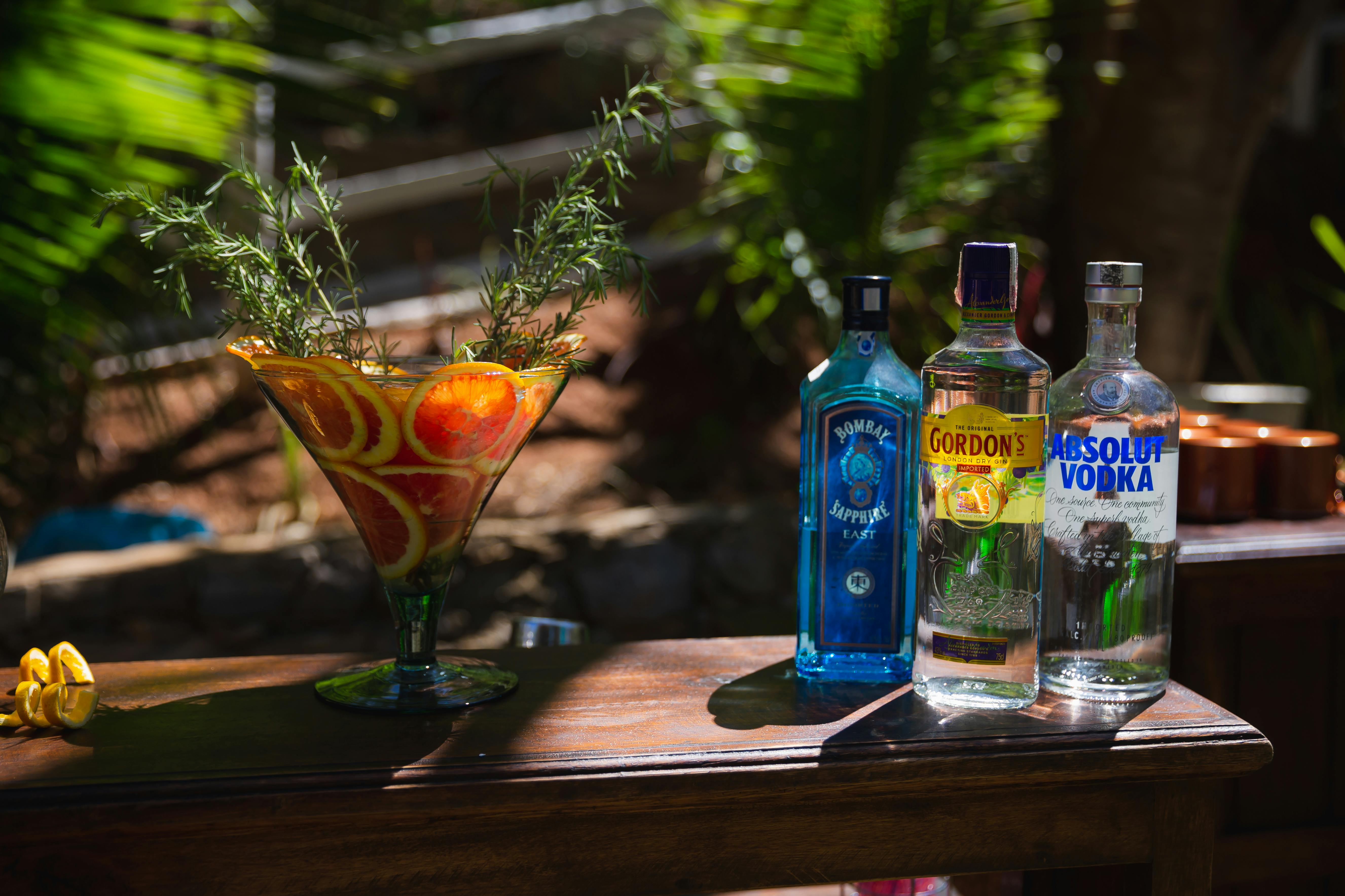Refreshing Cocktail Setup with Citrus and Spirits · Free Stock Photo