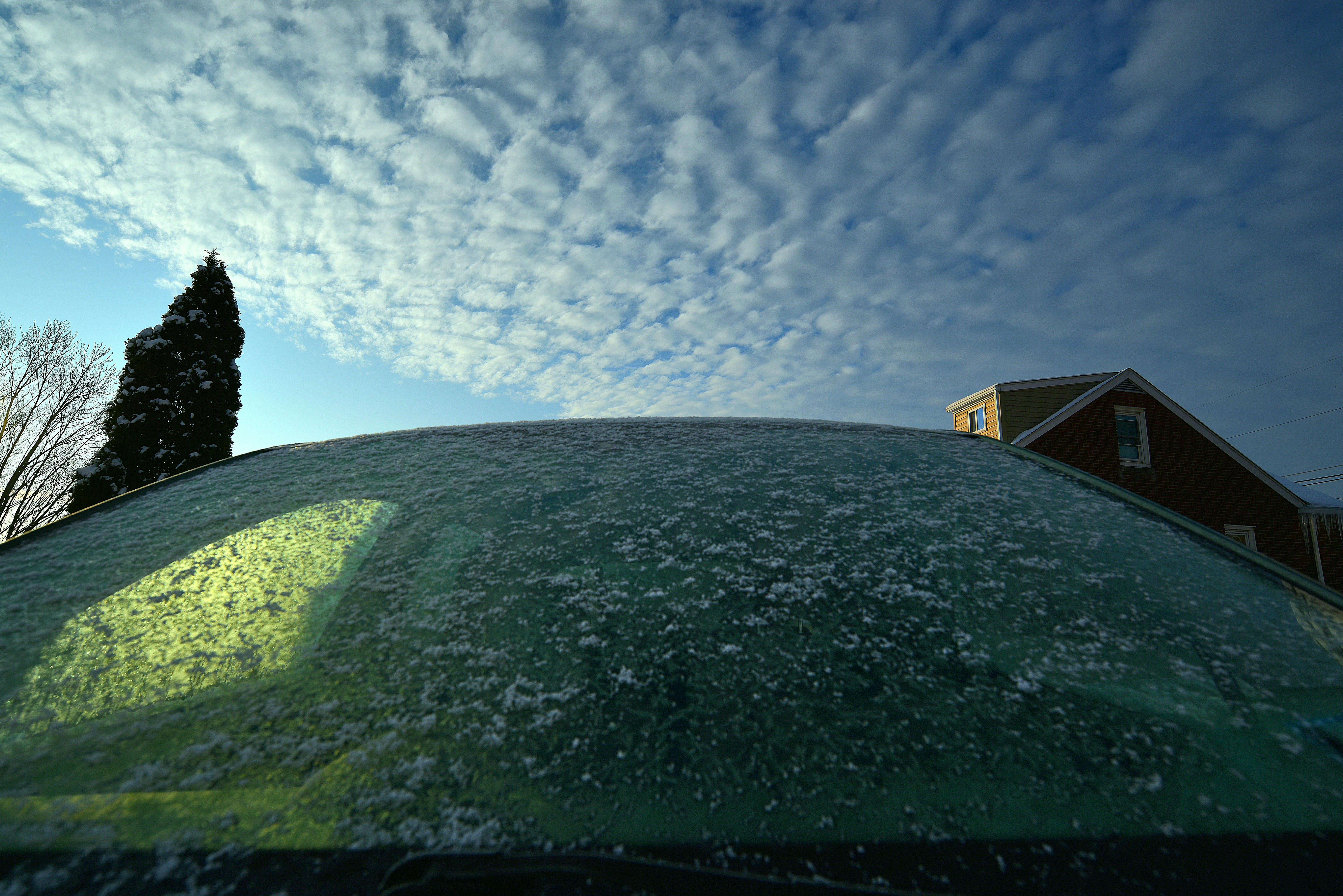 Frost-Covered Car in a Winter Suburban Scene · Free Stock Photo