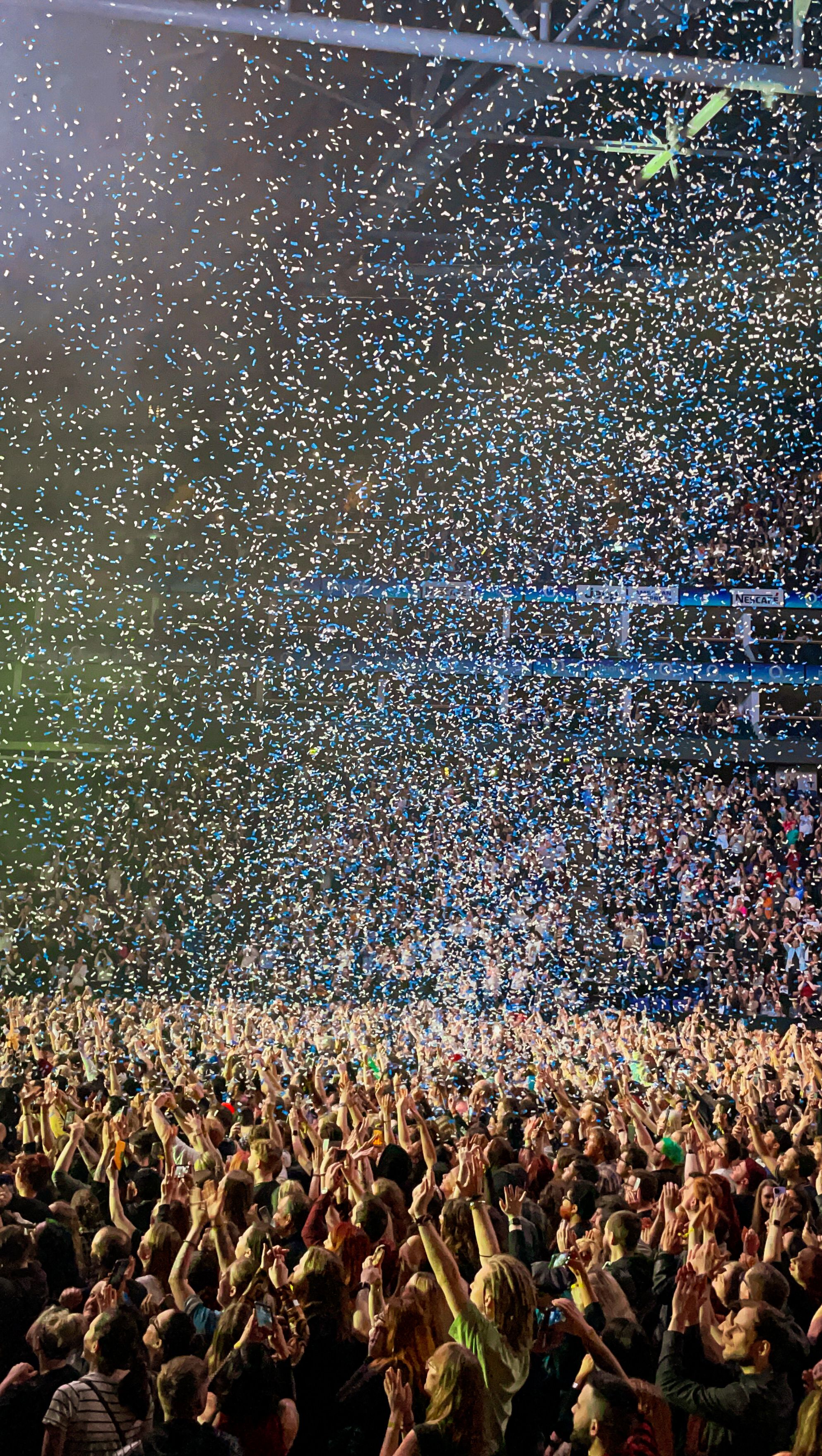 Vibrant Concert Crowd with Confetti Shower · Free Stock Photo