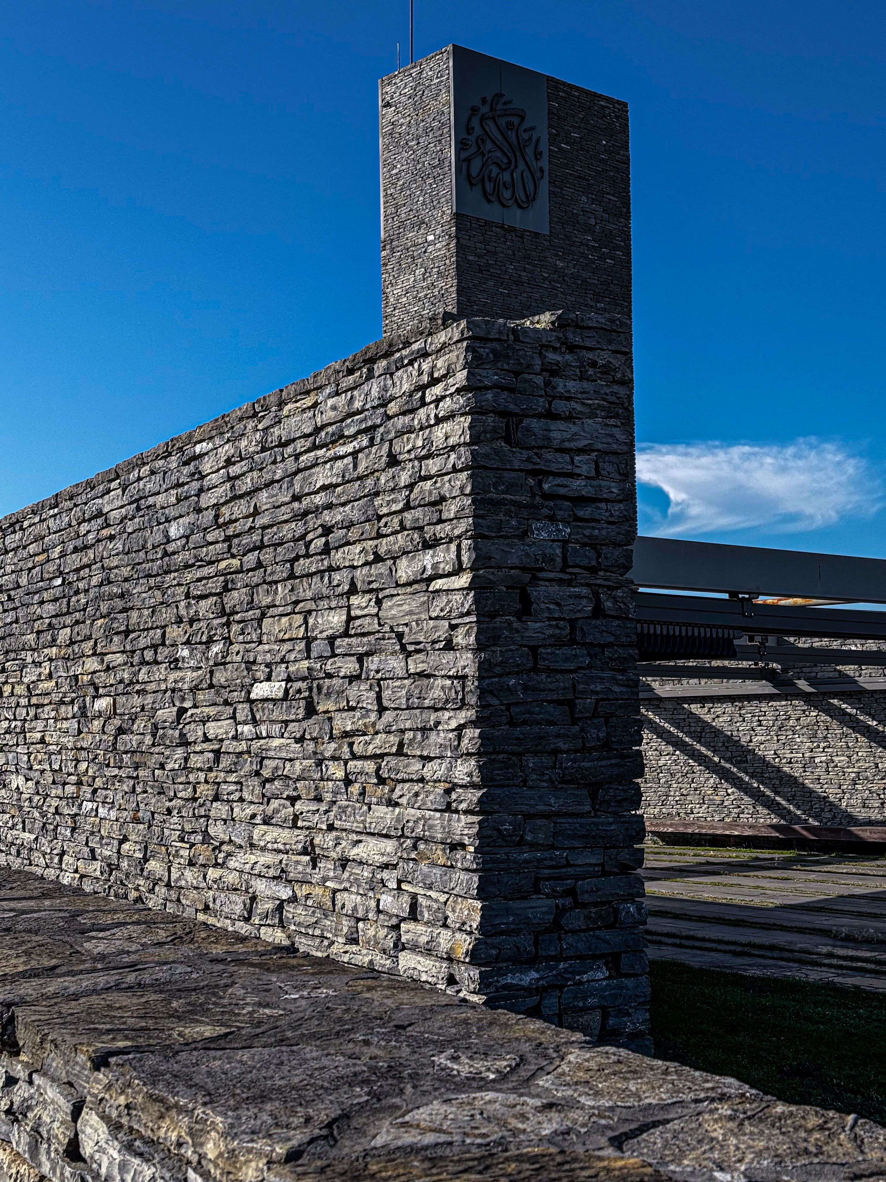 Stone Wall with Artistic Inscription in Sunlight · Free Stock Photo
