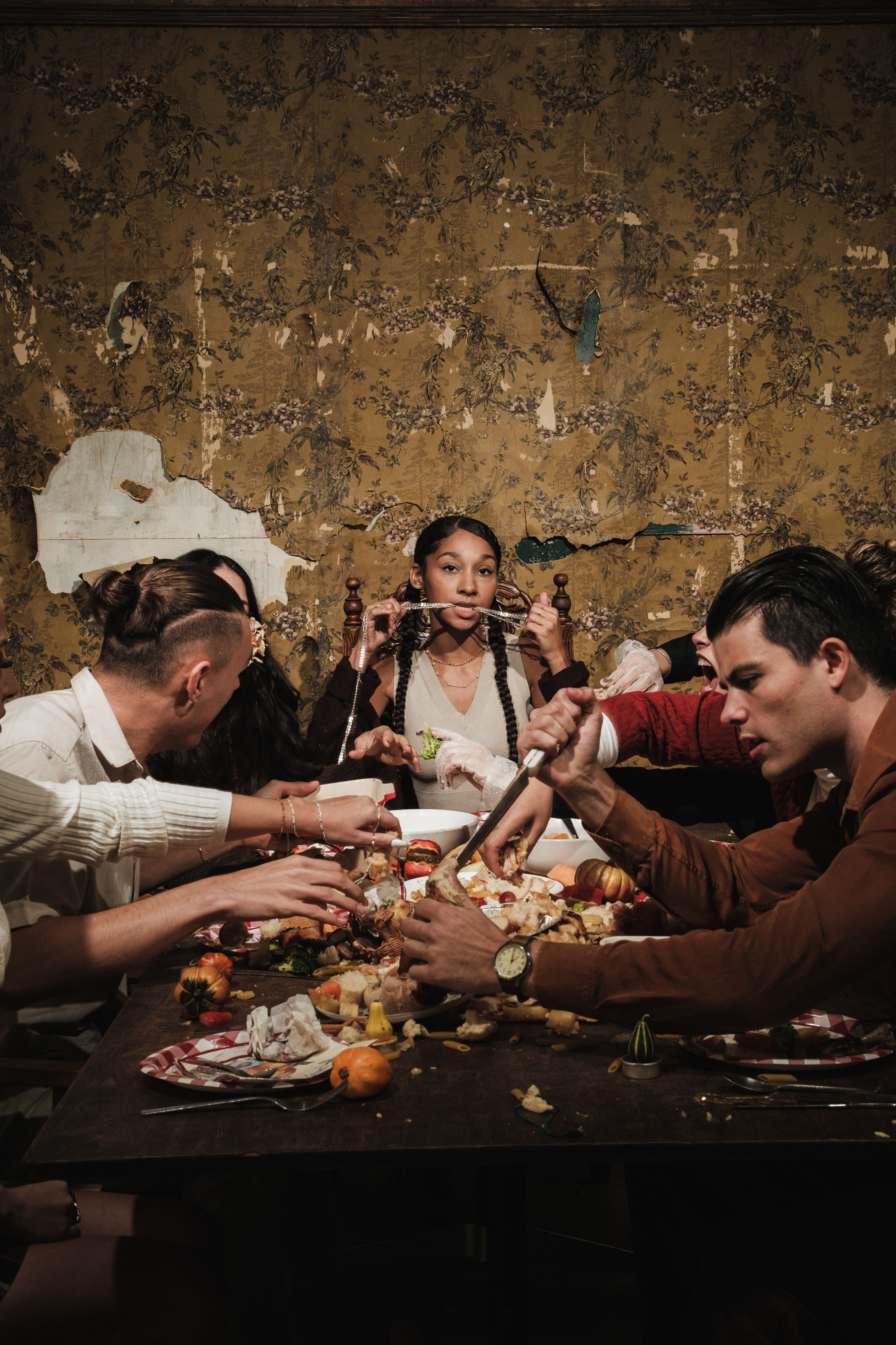 Diverse Group Gathering Around Festive Dinner Table · Free Stock Photo