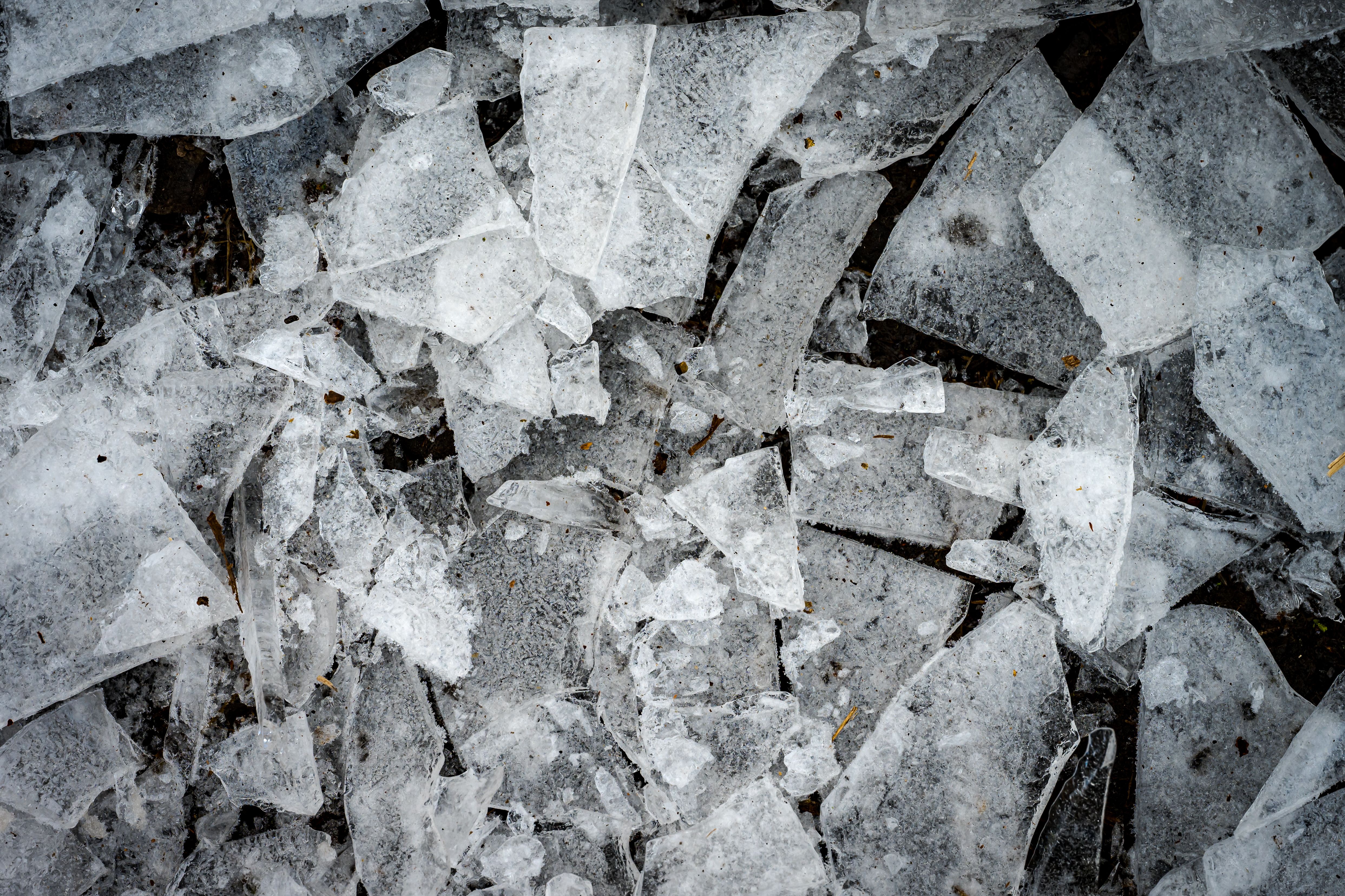 Close-up of Shattered Ice on the Ground · Free Stock Photo