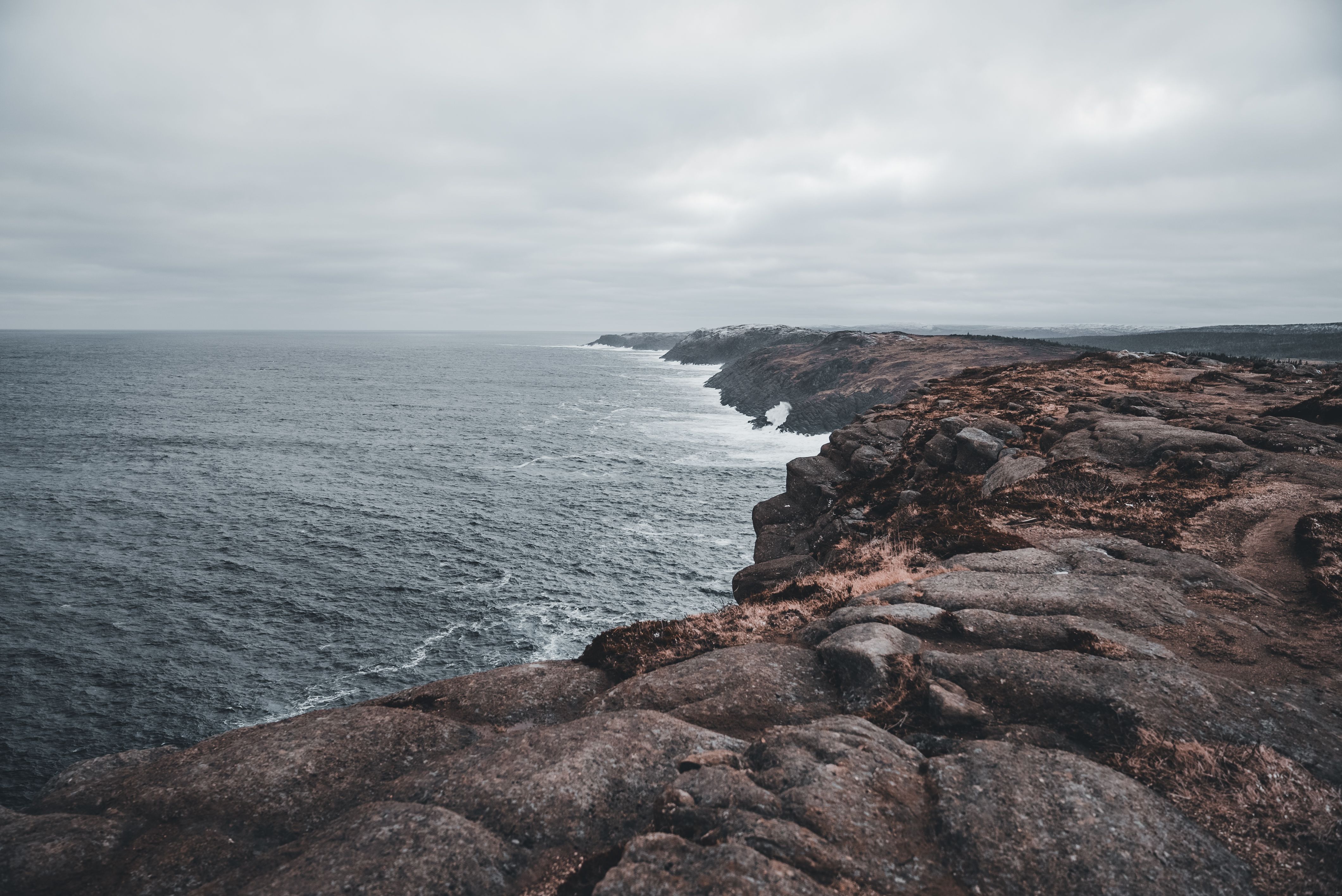 Dramatic Coastal Cliffs Overlooking the Ocean · Free Stock Photo