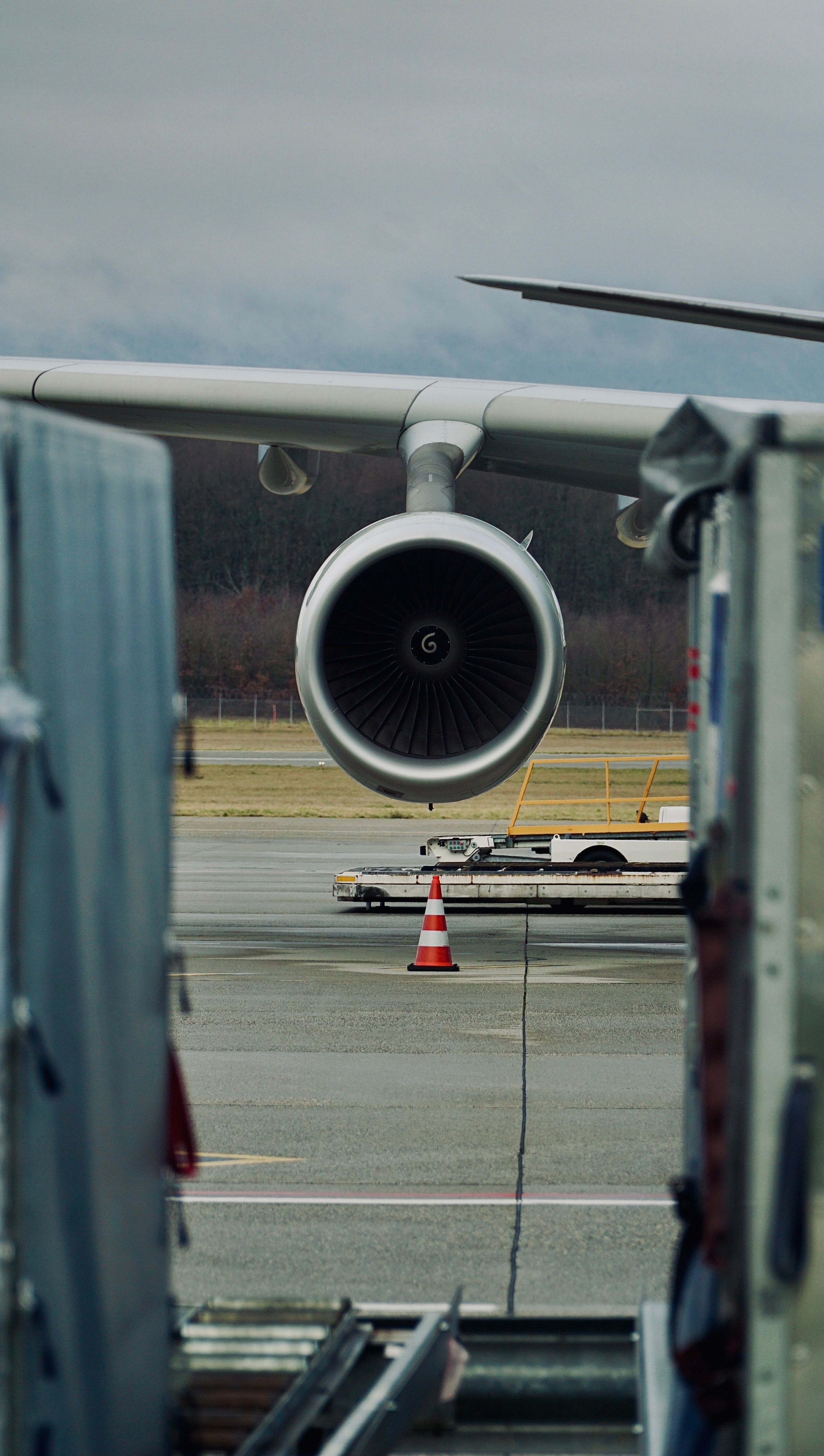 Airplane Jet Engine on Geneva Airport Runway · Free Stock Photo