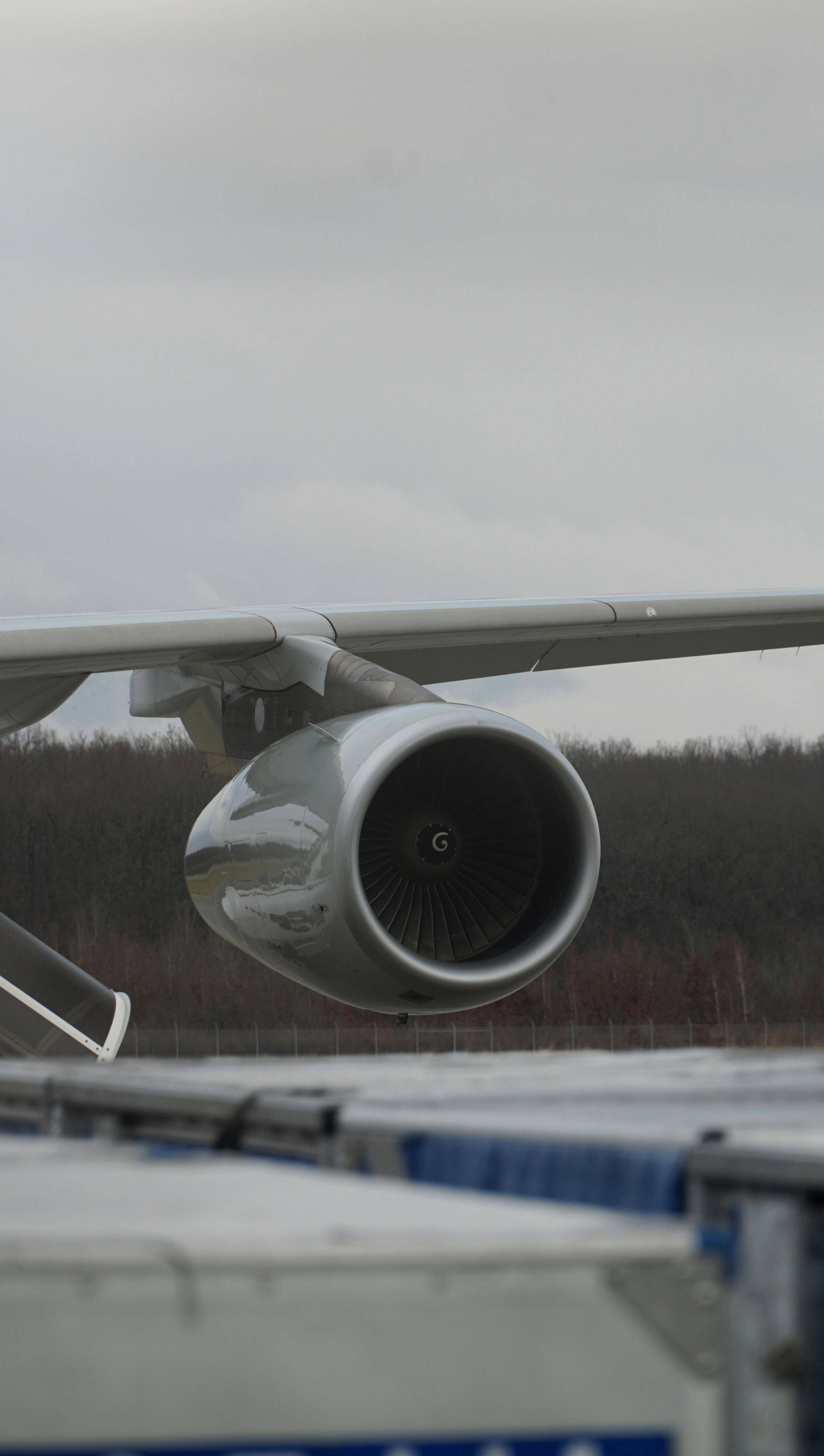 Close-up View of Airplane Jet Engine on Runway · Free Stock Photo