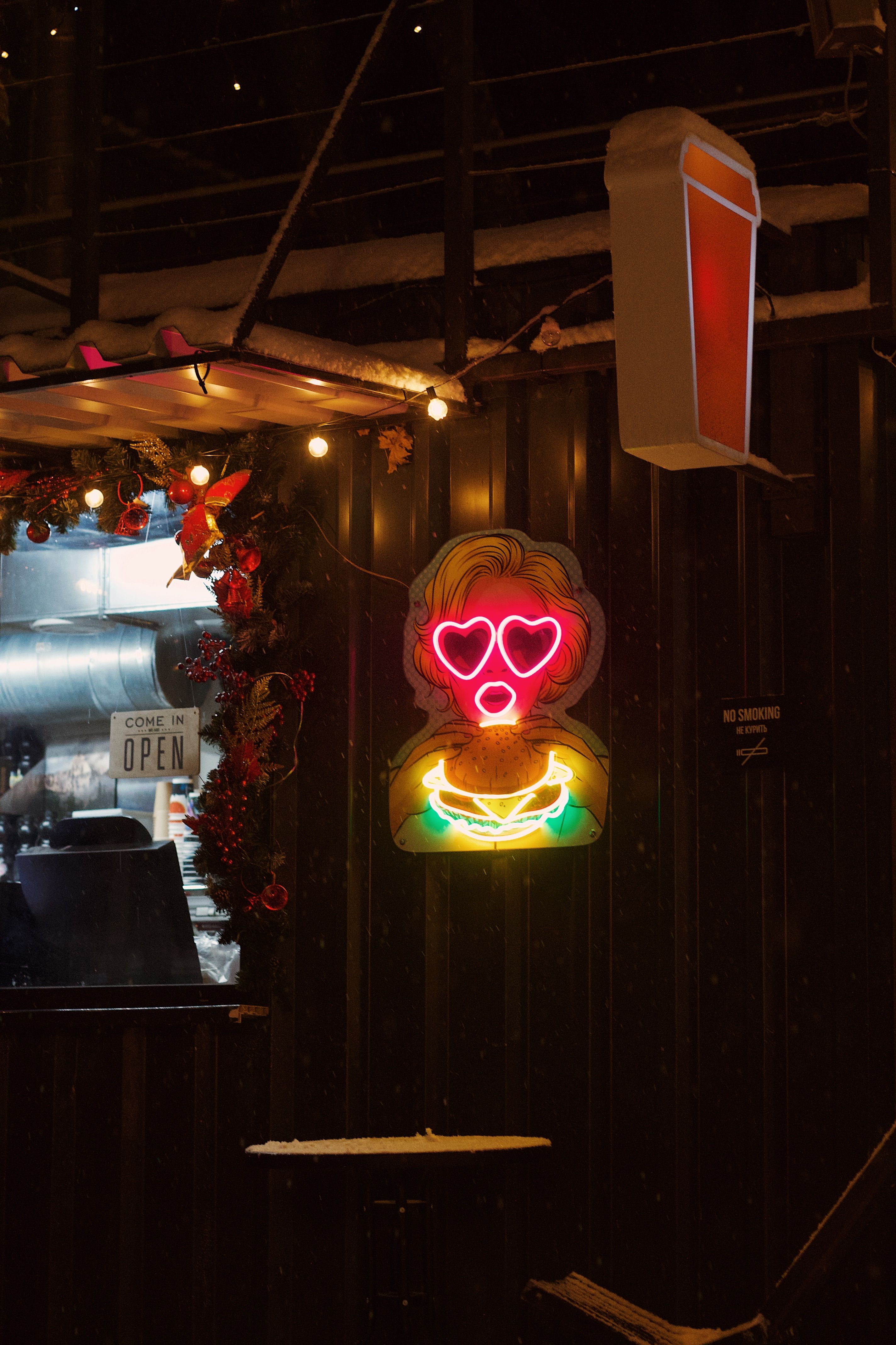Neon Sign Displaying Heart-Eyed Face at Night · Free Stock Photo
