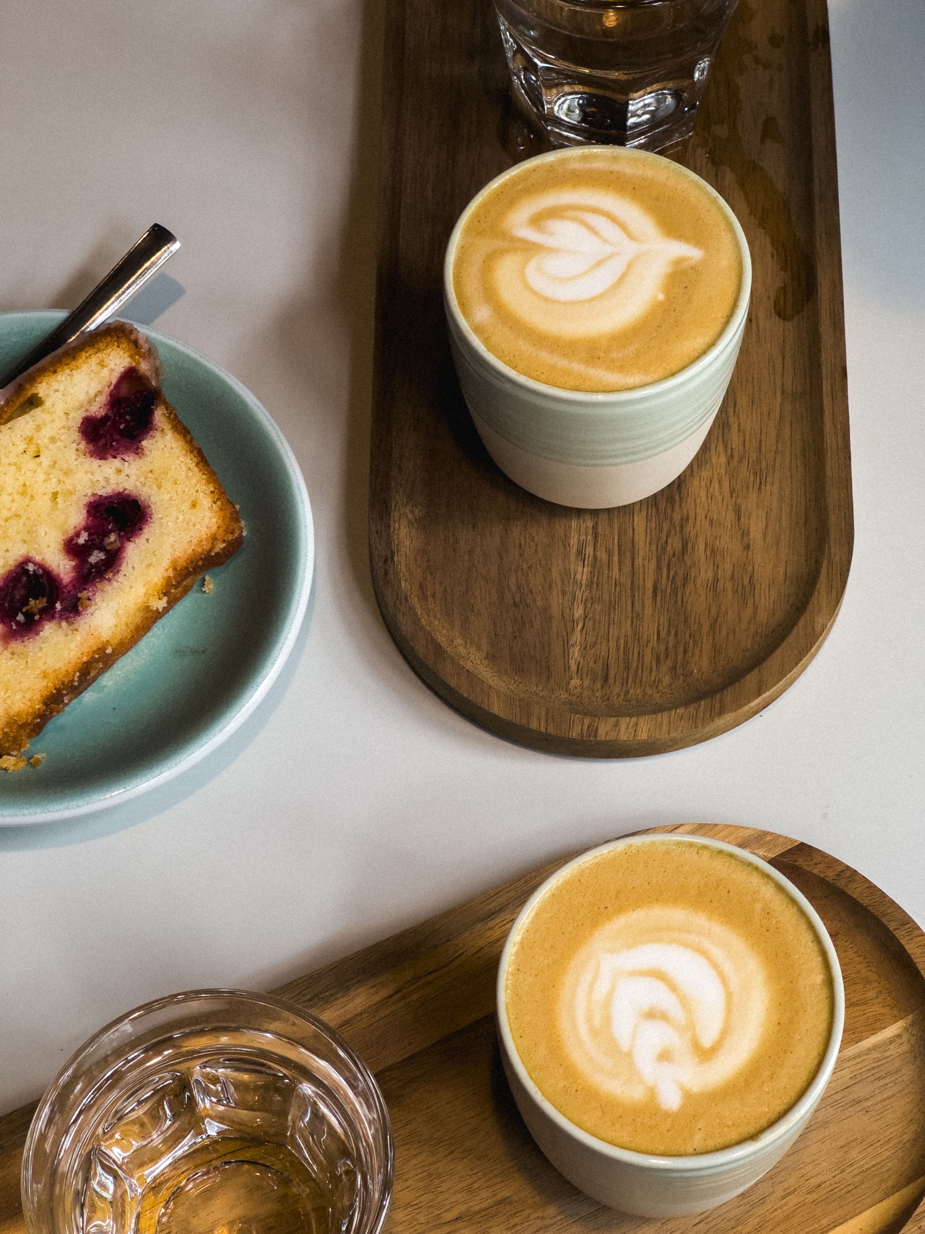 Latte Art and Berry Cake on Wooden Tray · Free Stock Photo