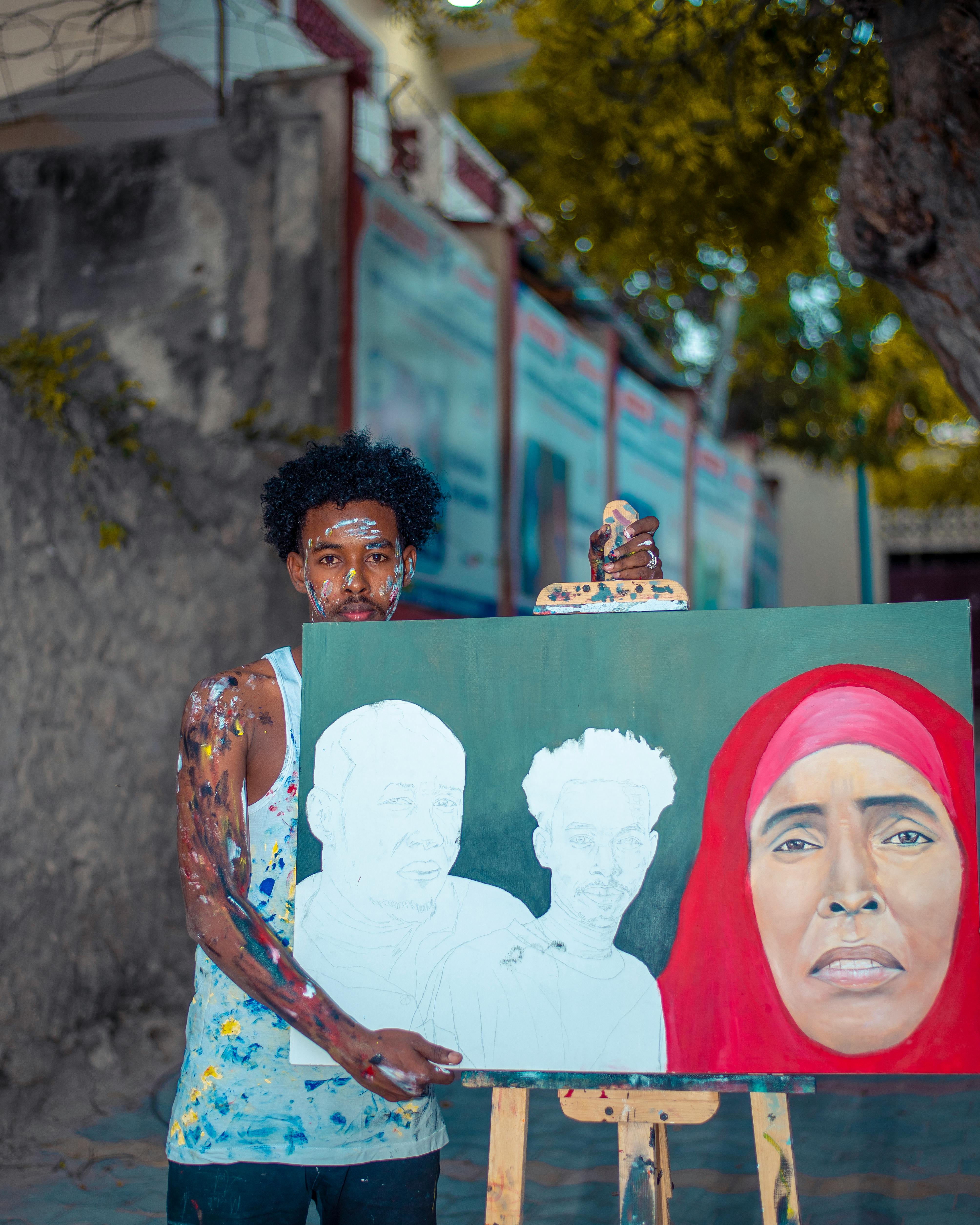 Artist Displaying Incomplete Portrait Painting in Somalia · Free Stock ...