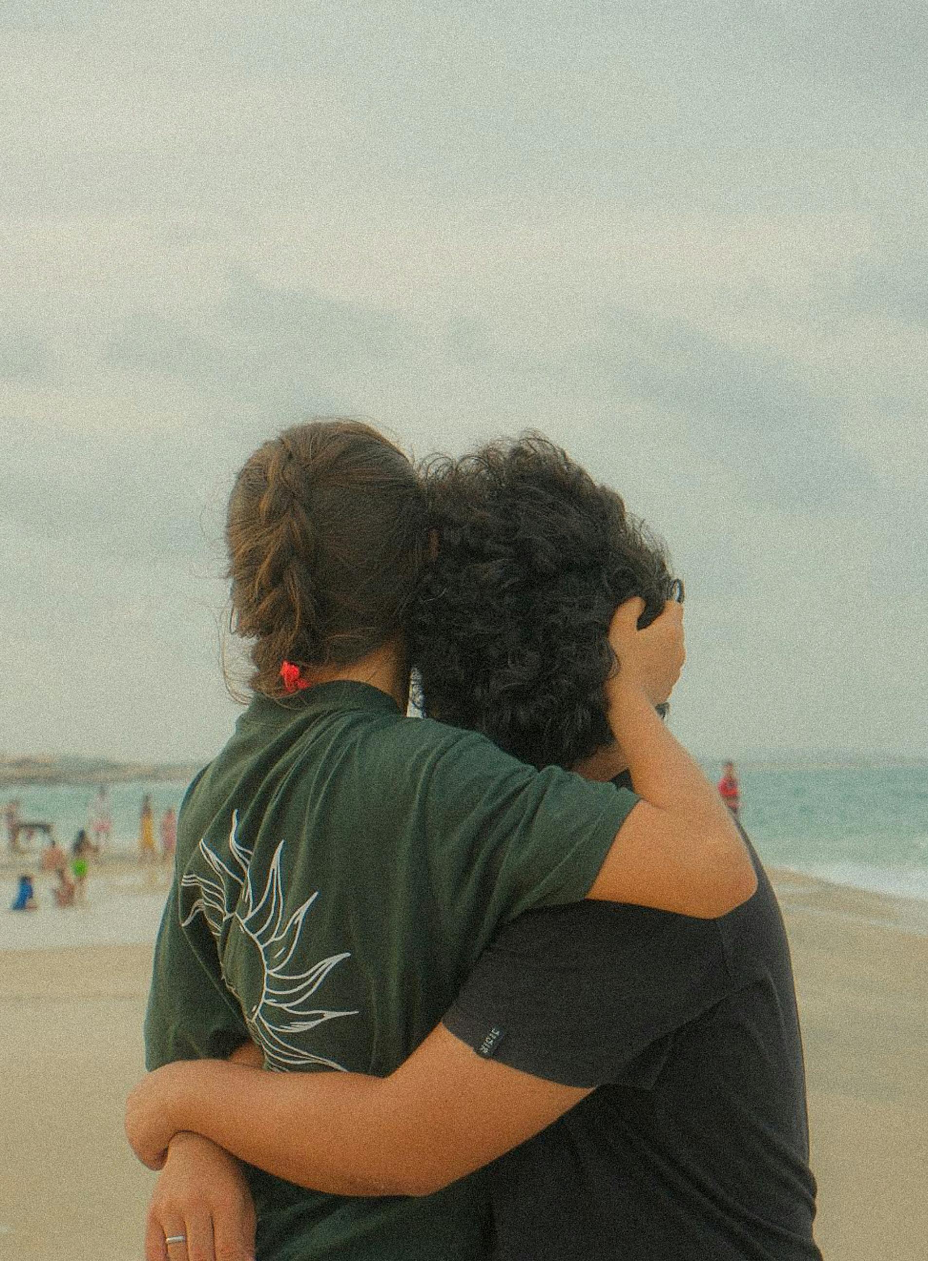 Romantic Couple Embracing on Brazilian Beach · Free Stock Photo
